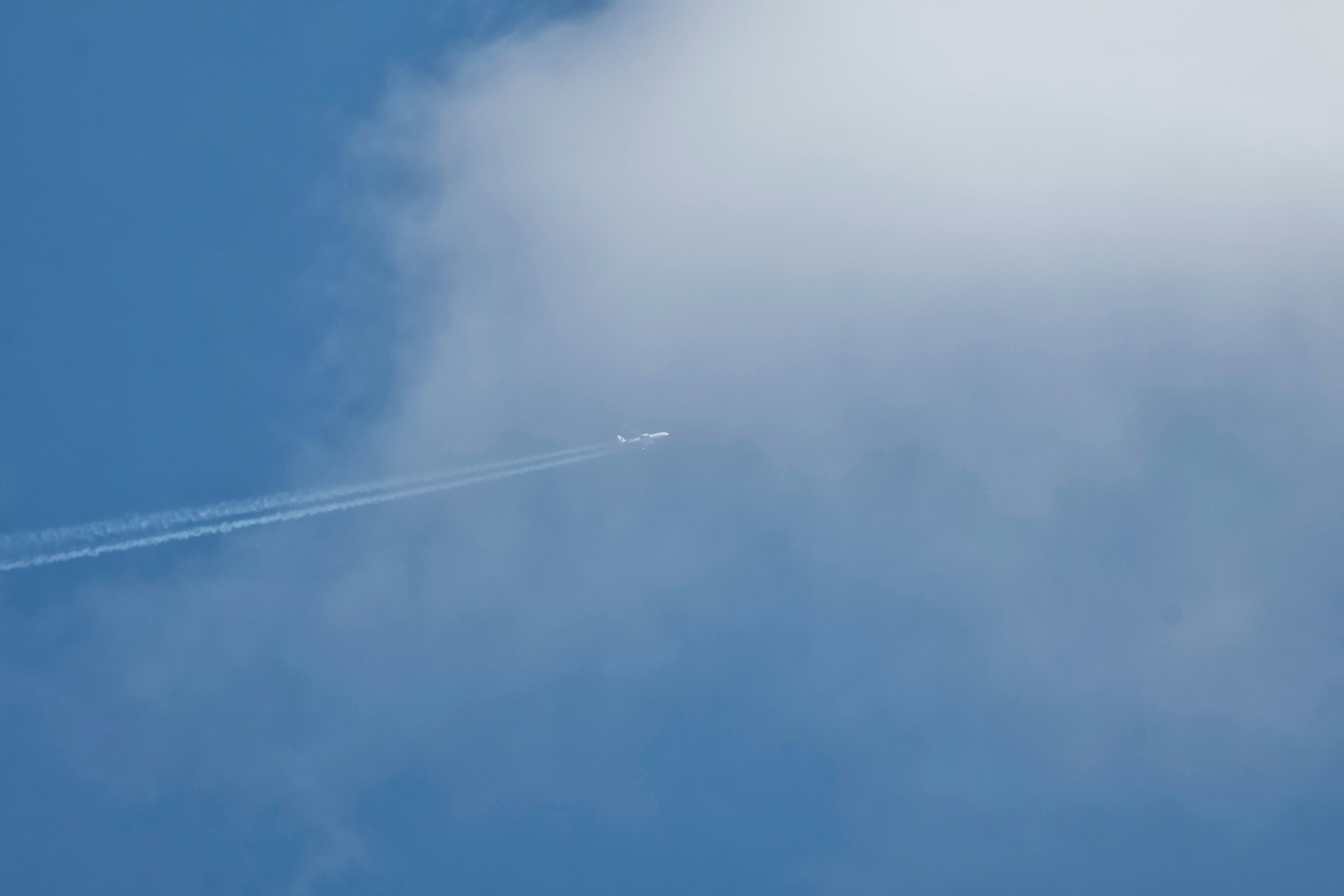 Jet Trace Across a Quiet Blue Sky