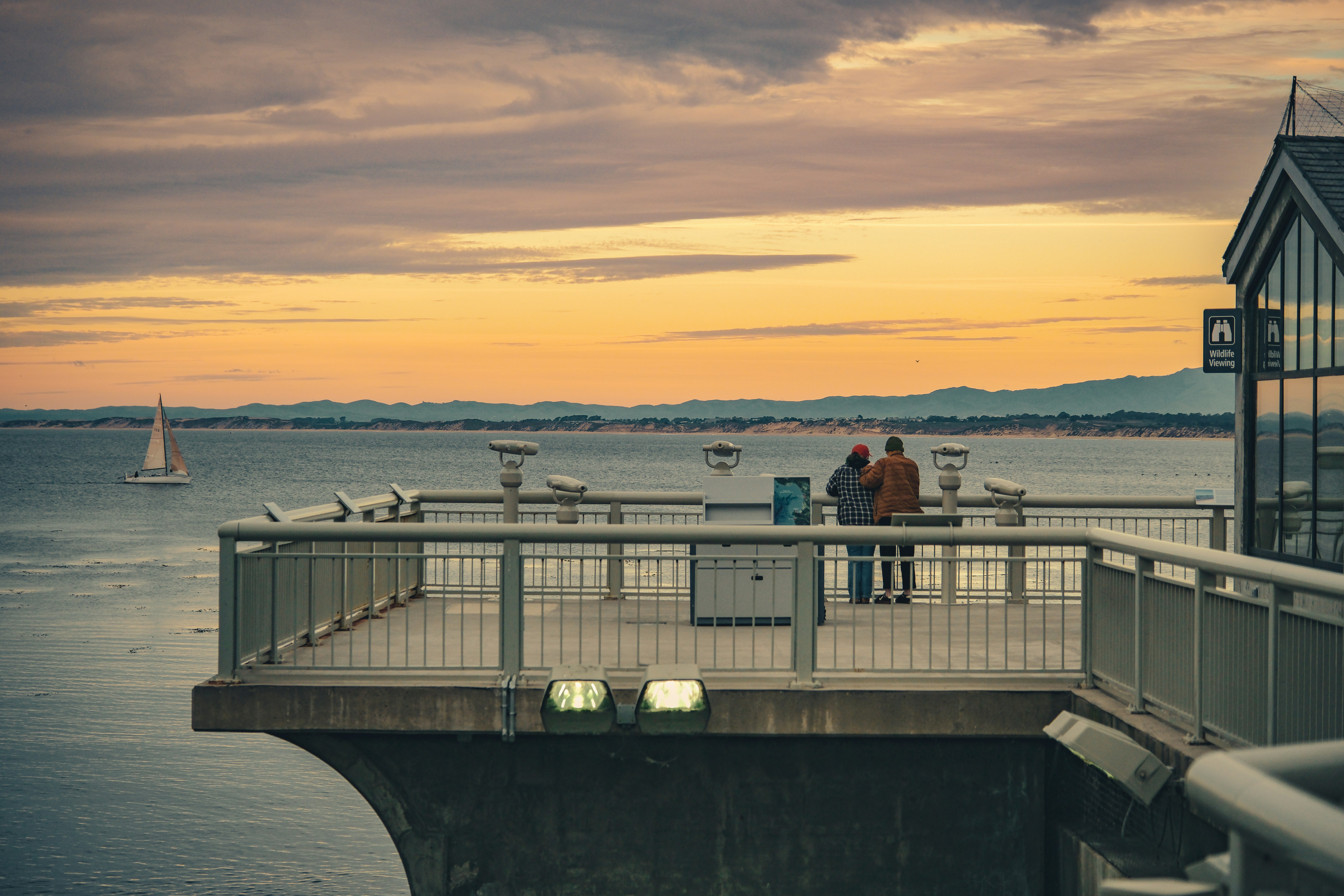 Sunset Balcony: A Quiet Moment on the Pier