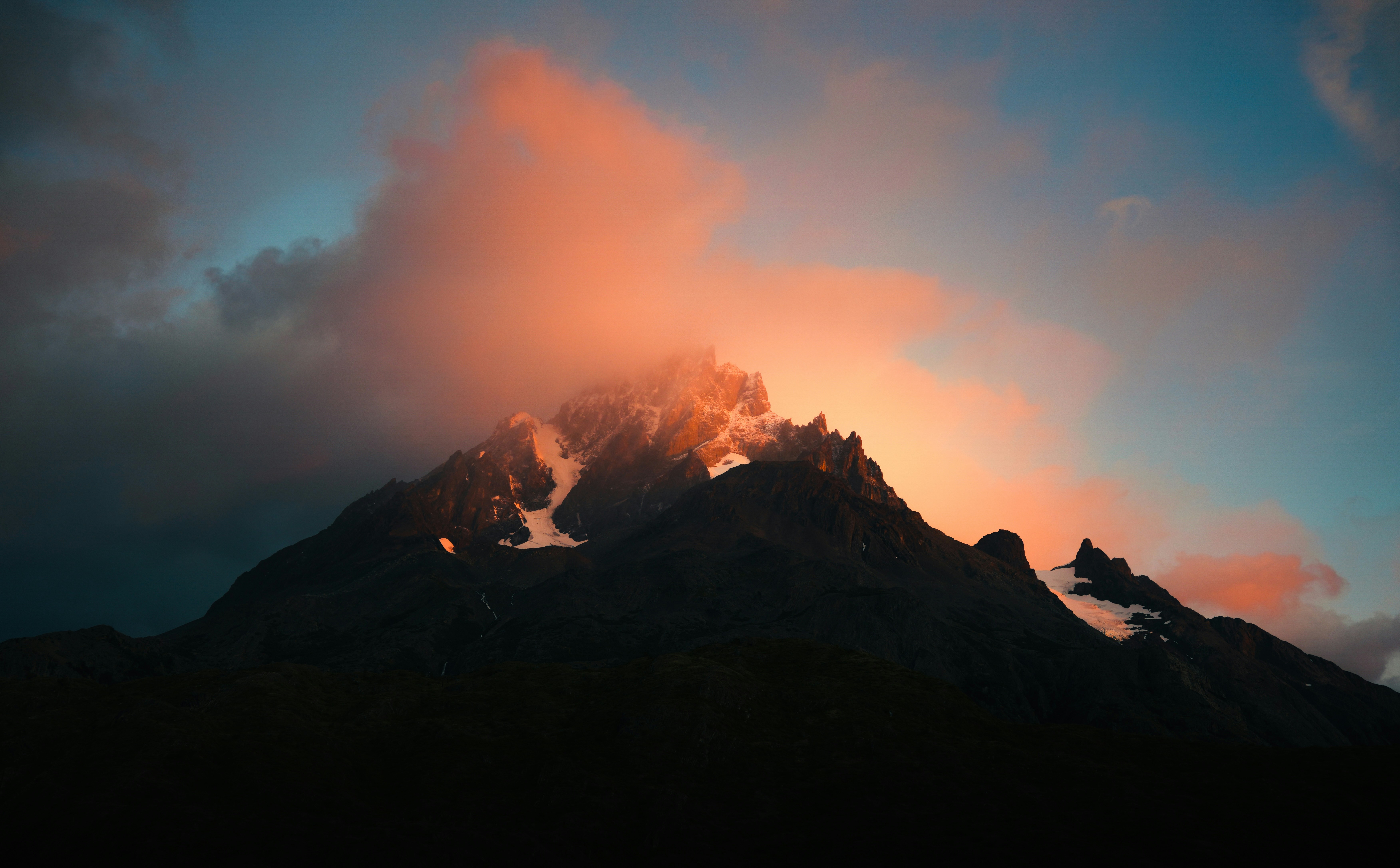 Sunlit Peak: A Quiet Crest Emerging from Evening Clouds
