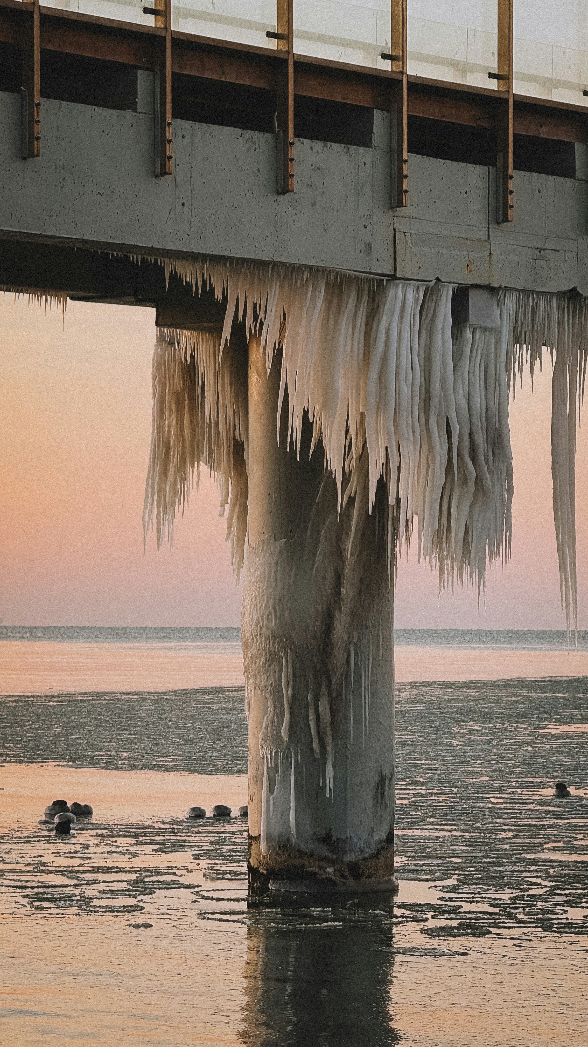 Icicles on a Pier Column at Sunset