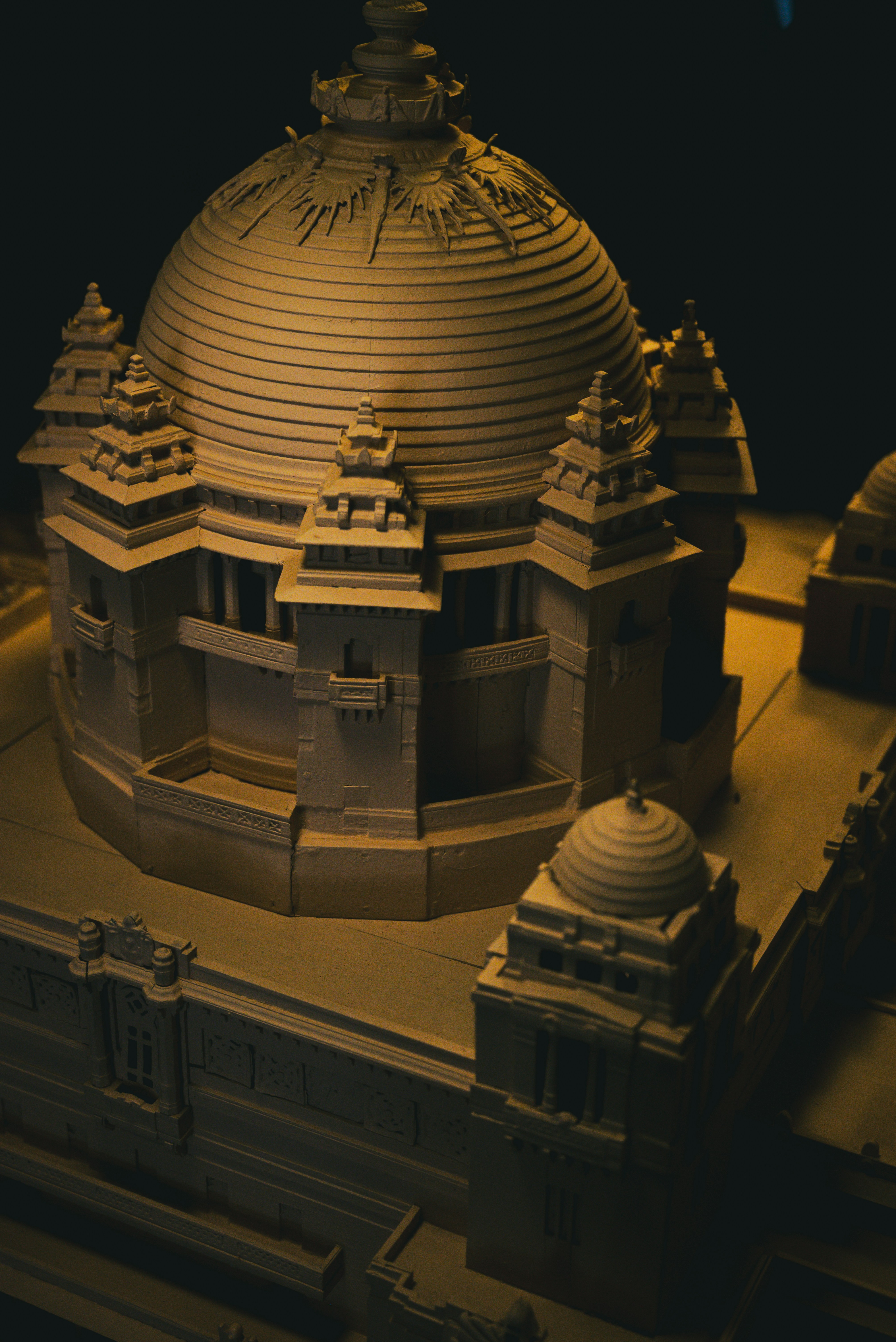 Dim-lit Dome: A Miniature Shrine Under Warm Spotlight