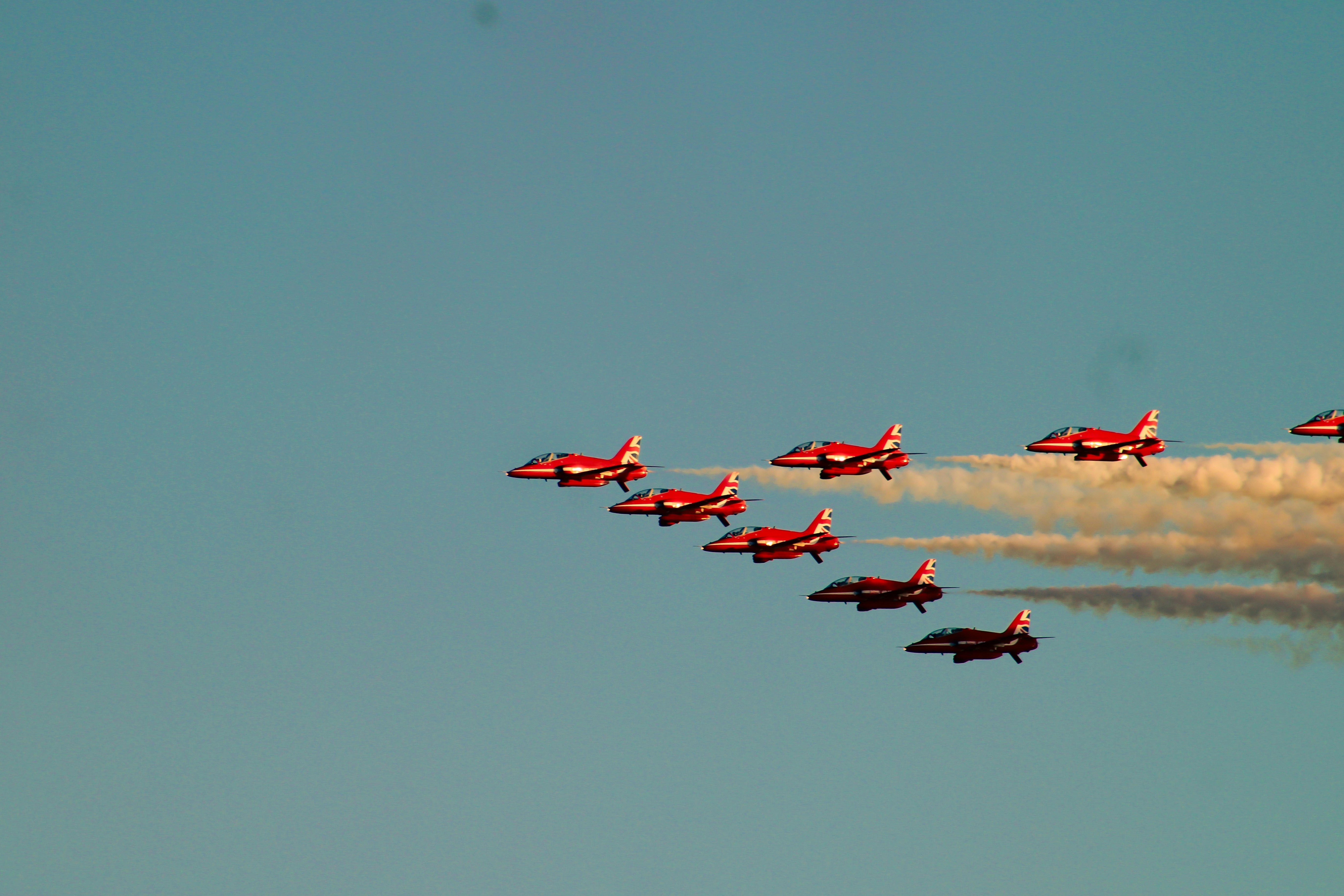 Red Jet Chorus Against a Clear Sky