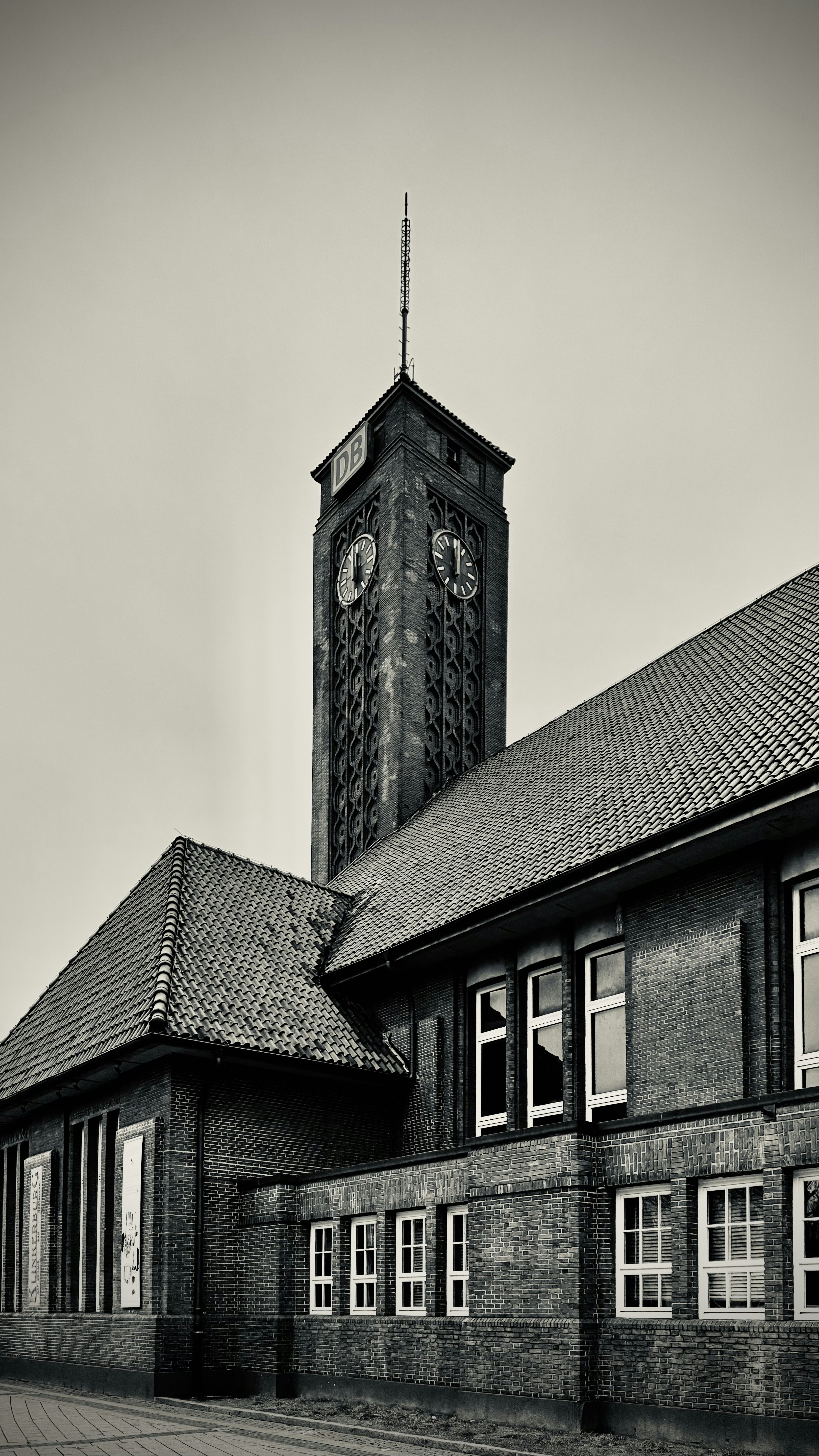 Clock Tower over Brick Campus: An Angled Facade in Sepia