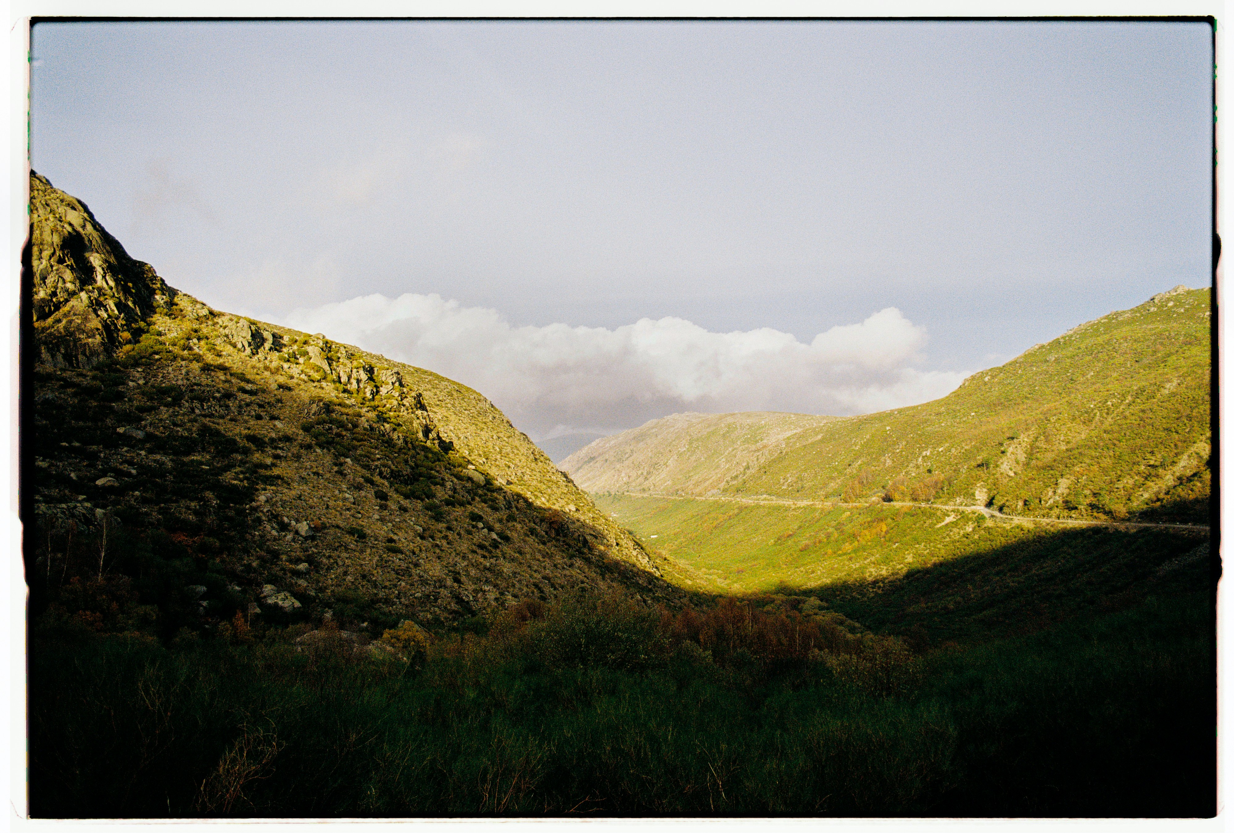 Sunlit Valley Between Quiet Ridges