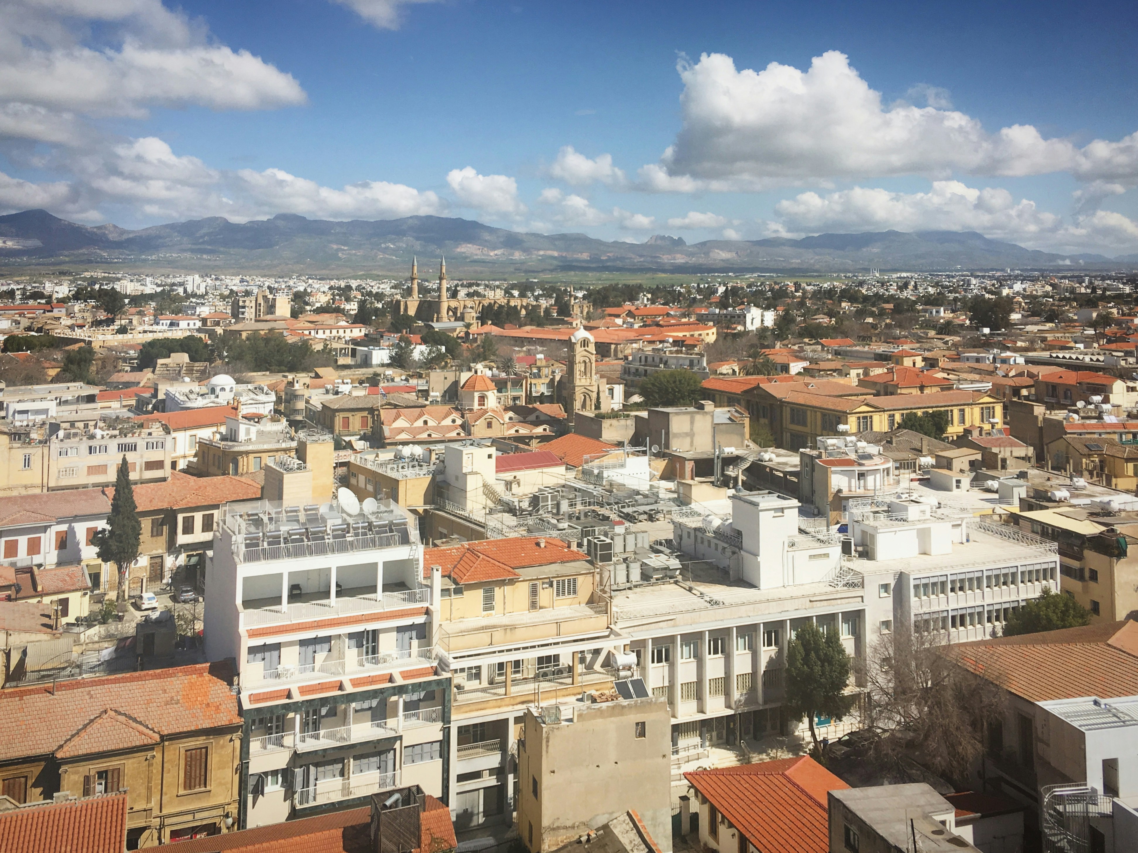Sunlit Mediterranean Roofscape Over a Terracotta-Tiled City