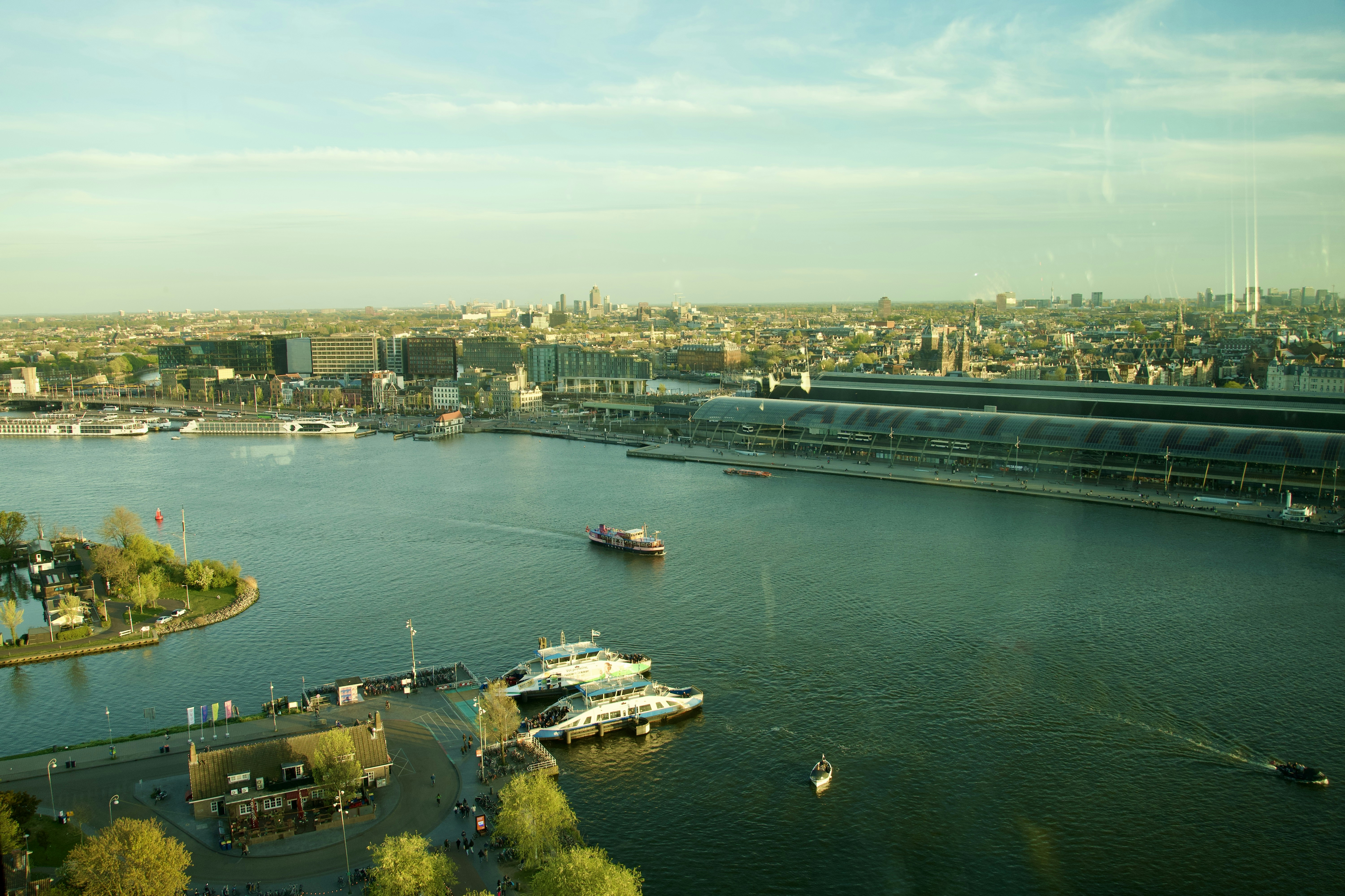 Harbor Panorama: City Skyline Embraced by Calm Waters