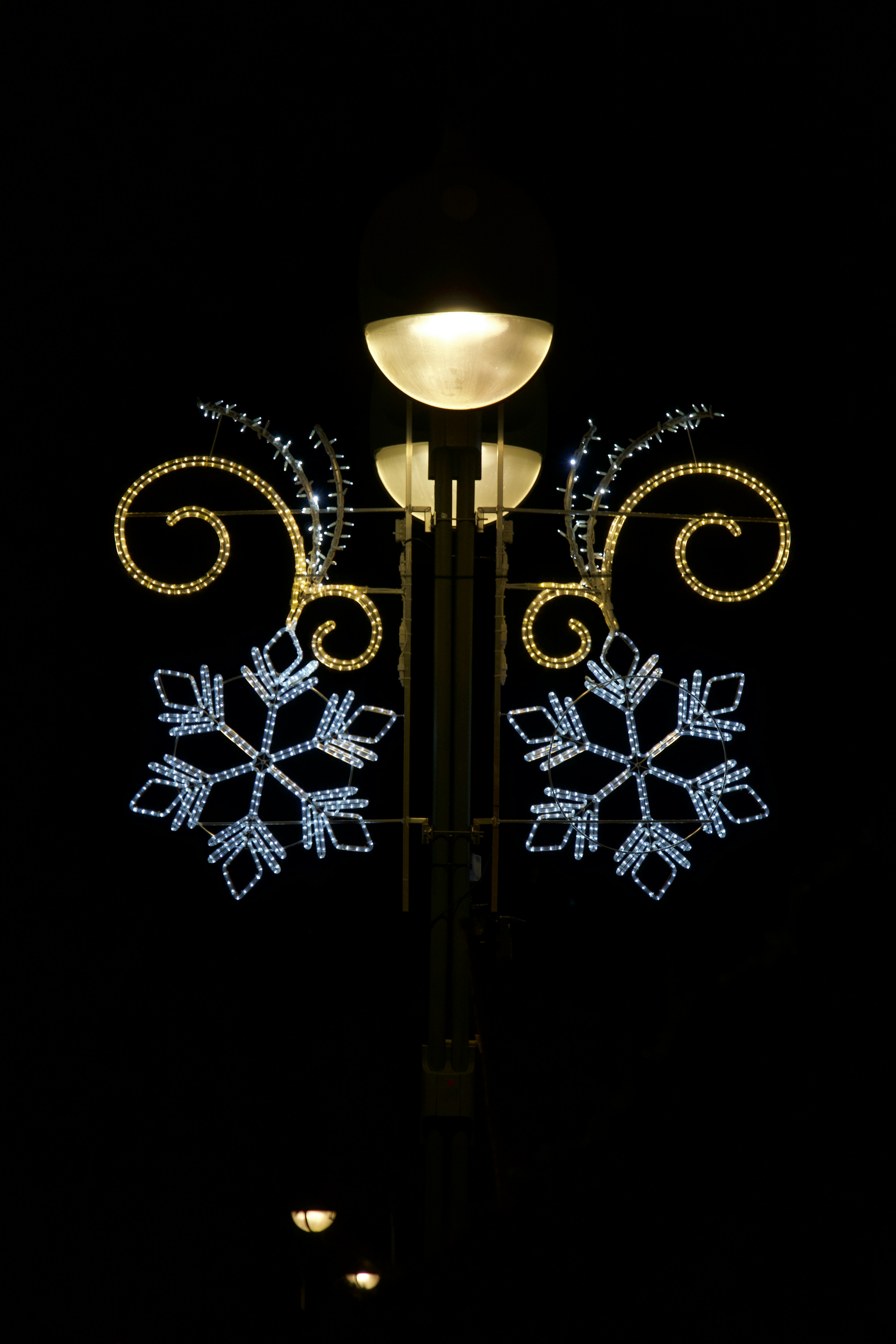 Nightfall Lamp Post Adorned with Snowflake Lights