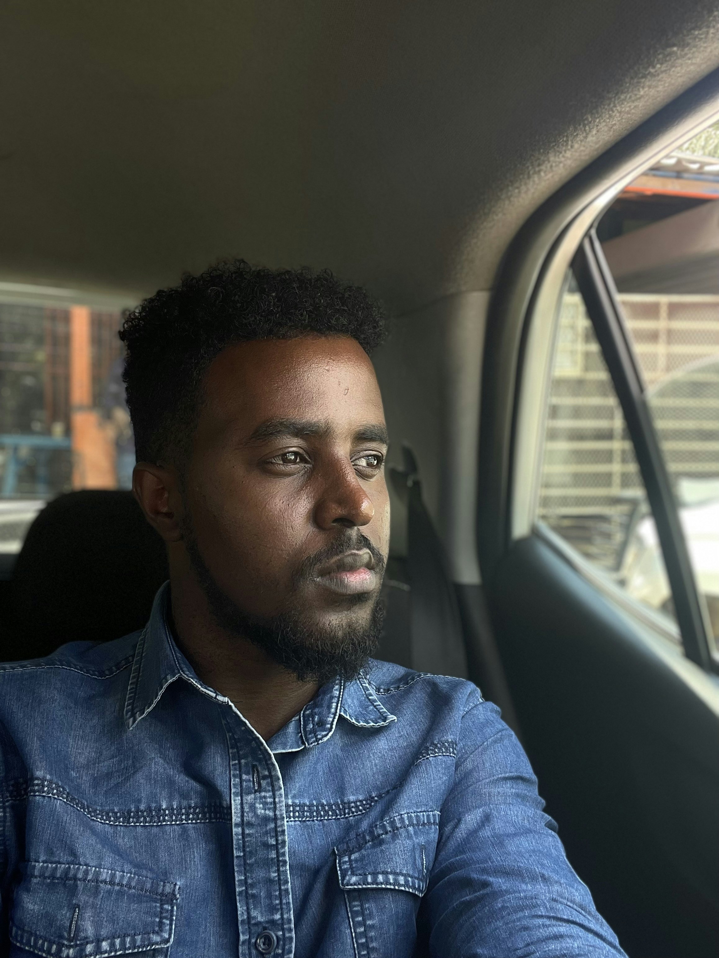 Quiet Contemplation: Portrait Inside a Car Window