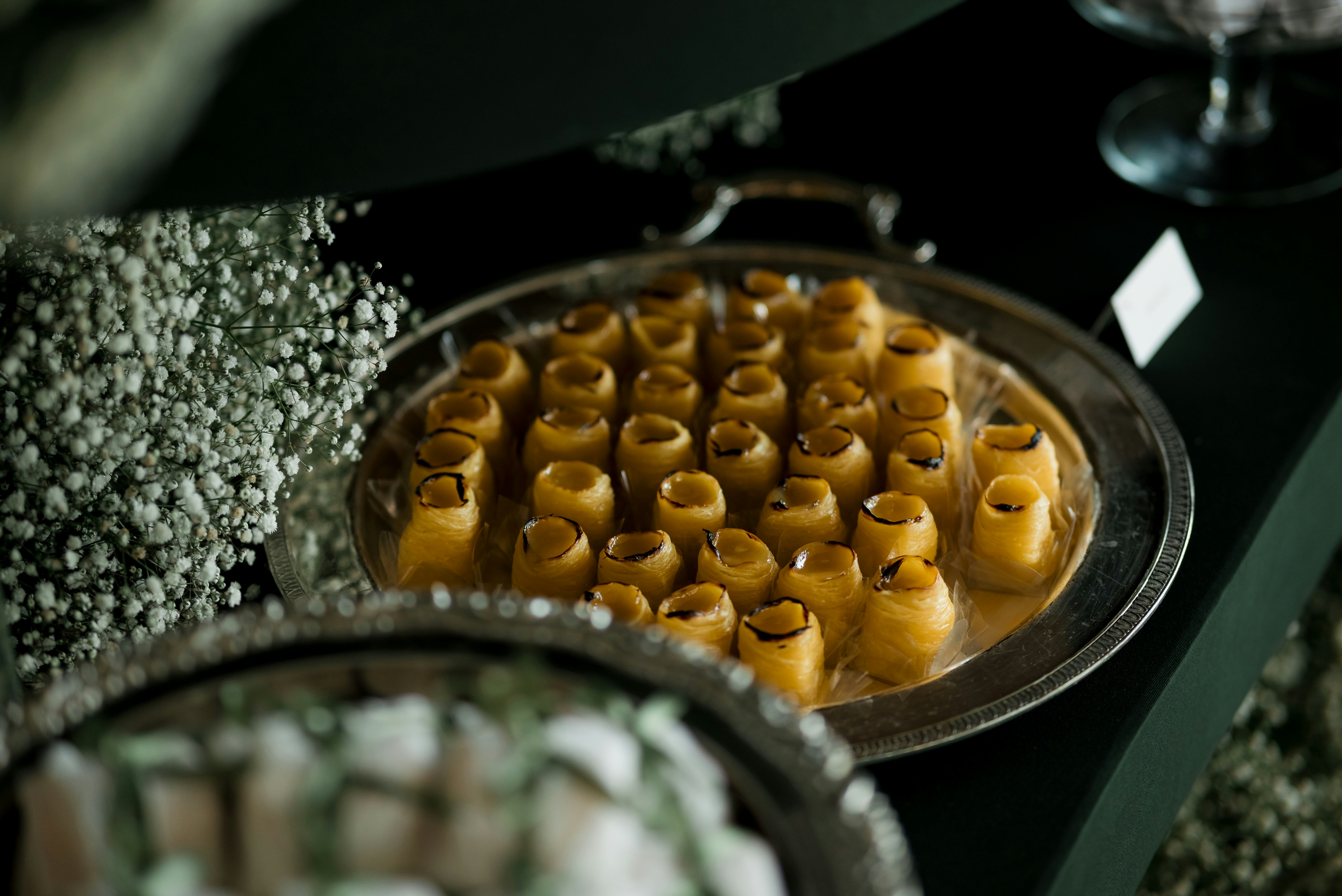 Golden Roll Morsels on a Glass Display