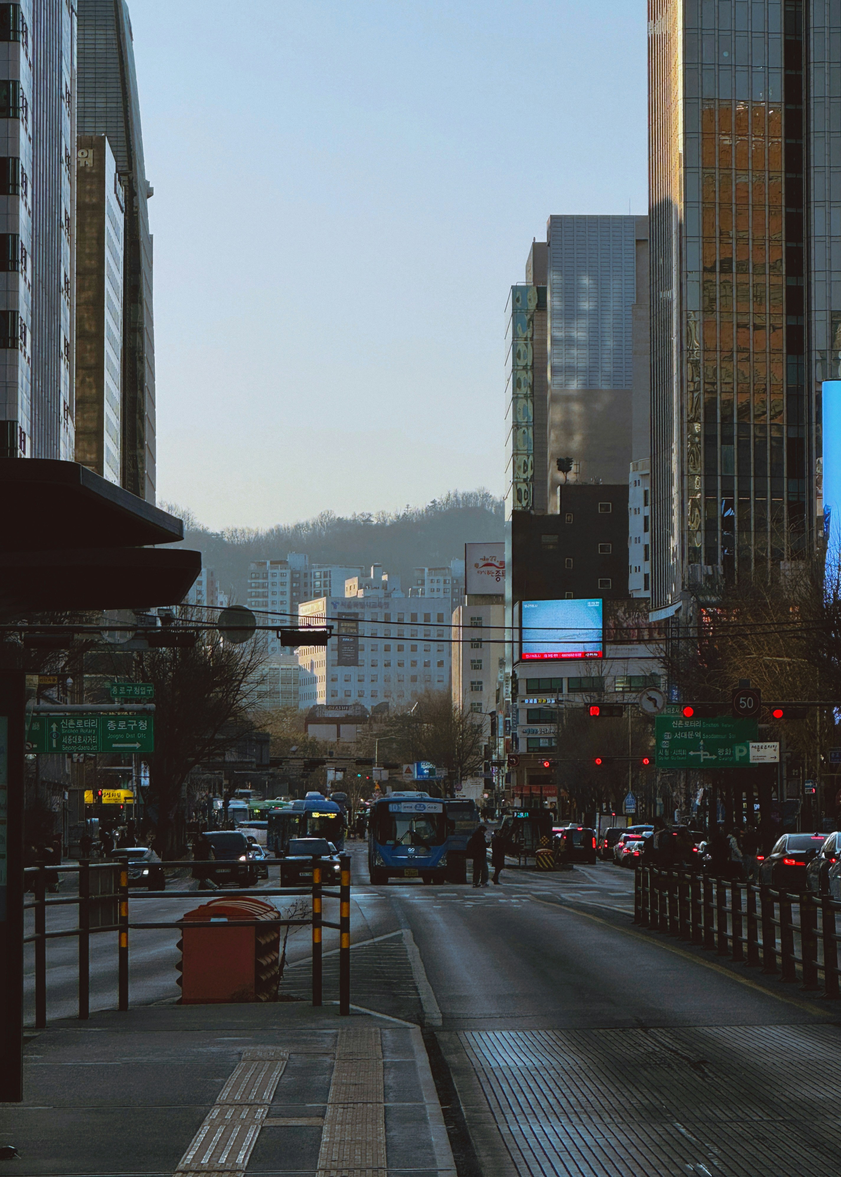 City Pulse: Sunset-glow Bus in a Glass Corridor