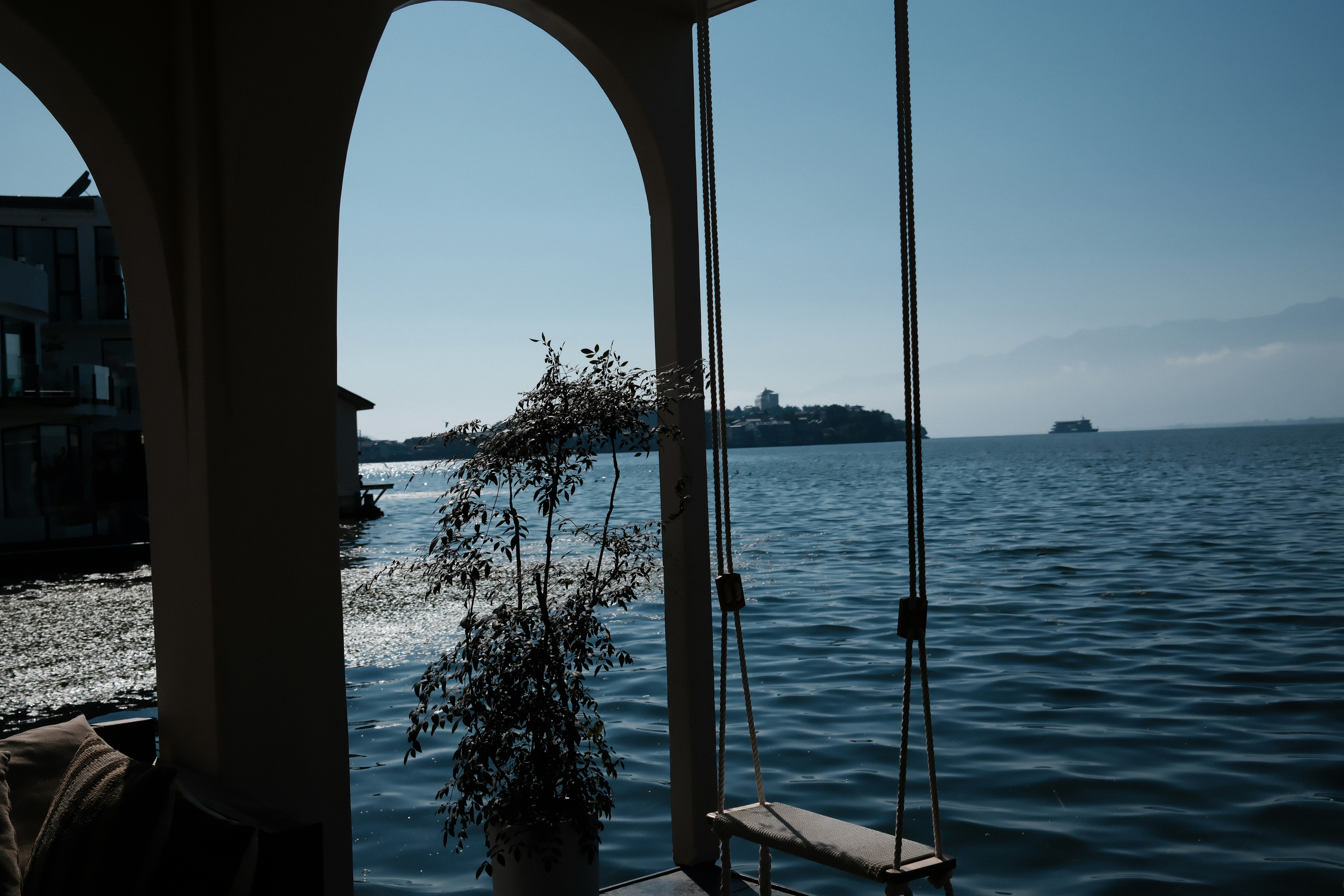 Shaded Veranda Overlooking a Quiet Lake at Dusk