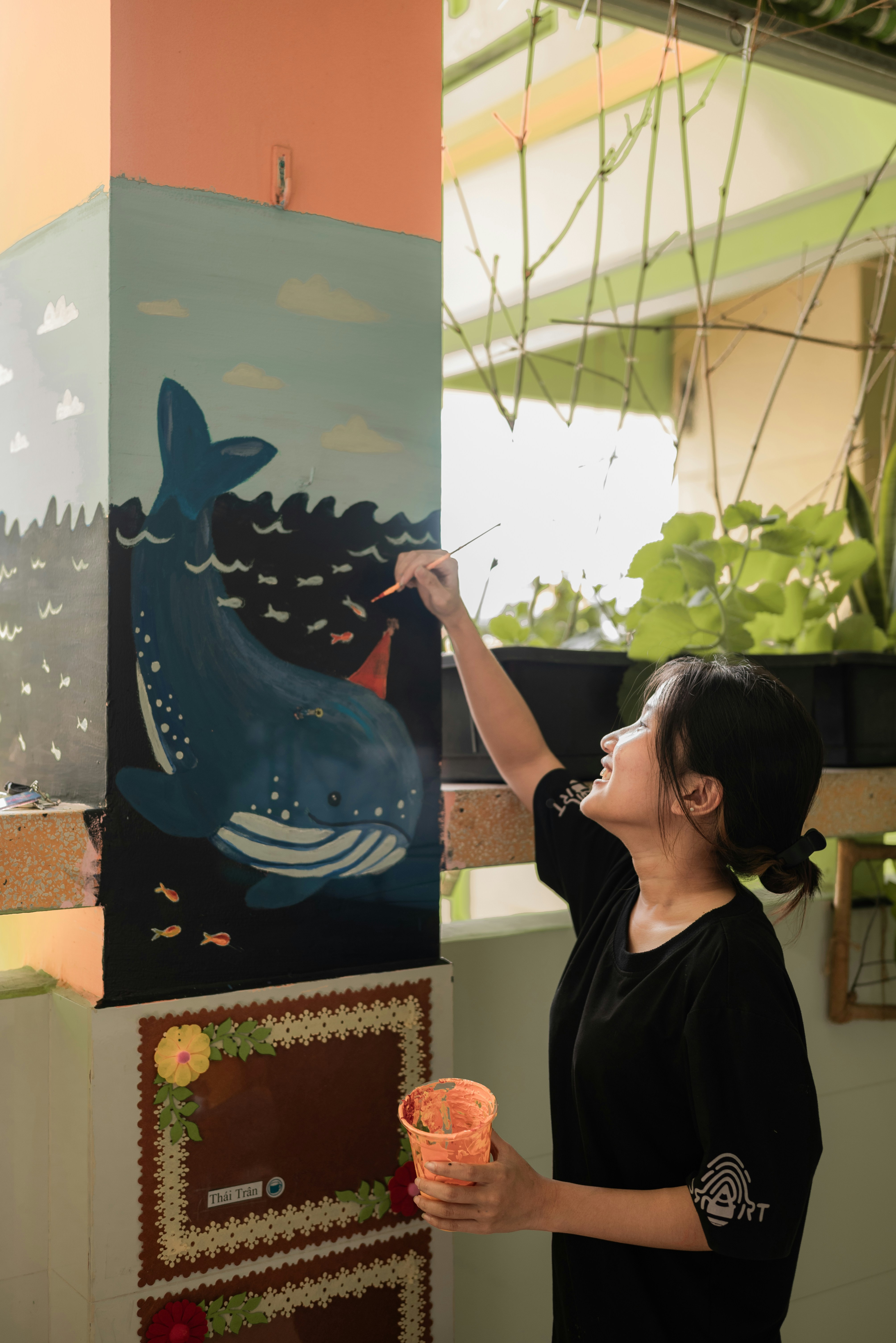 Painted Whale and Painter: A Quiet Portrait in Colorful Craft
