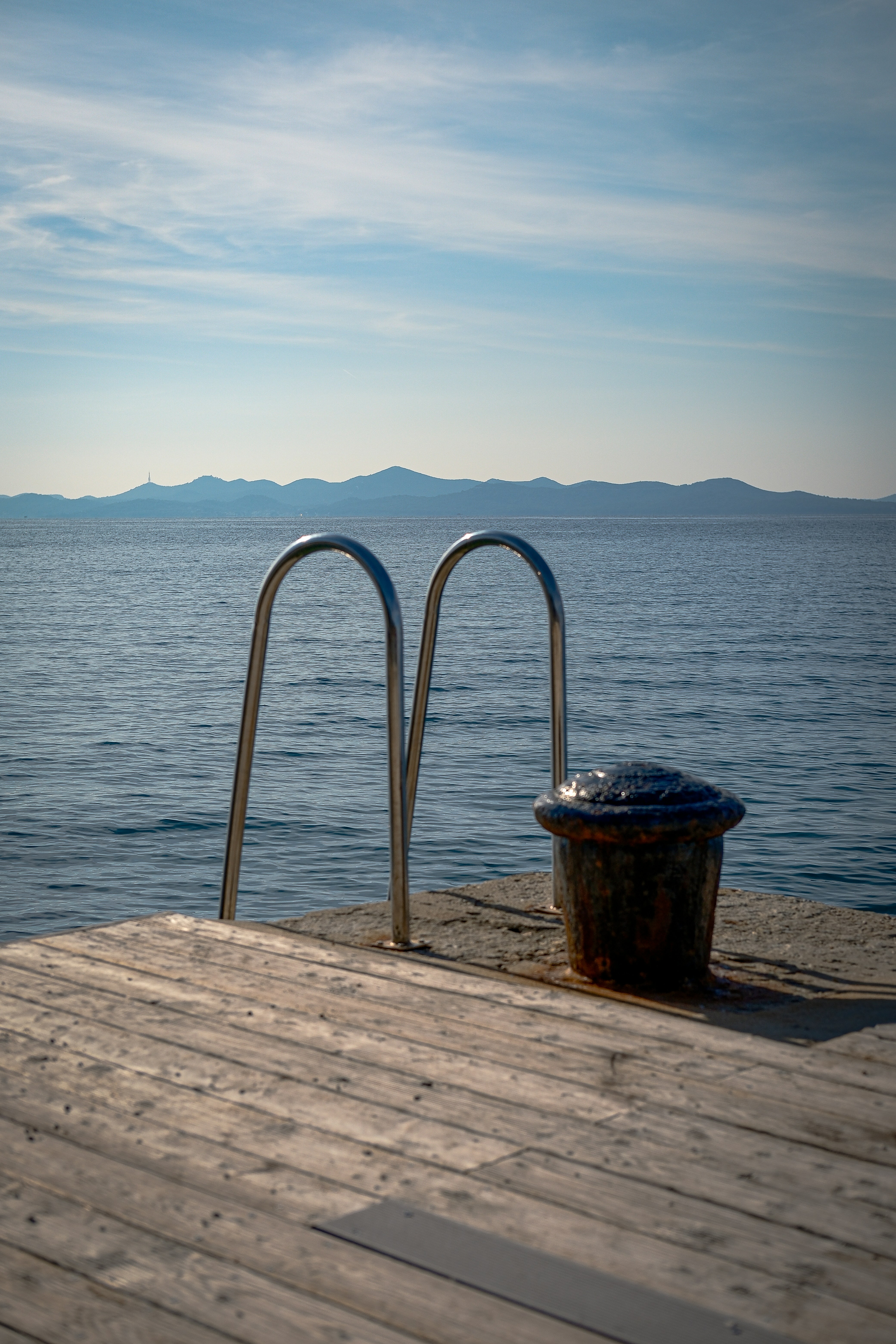 Rusted Mooring at Dusk: A Quiet Pier by the Open Sea