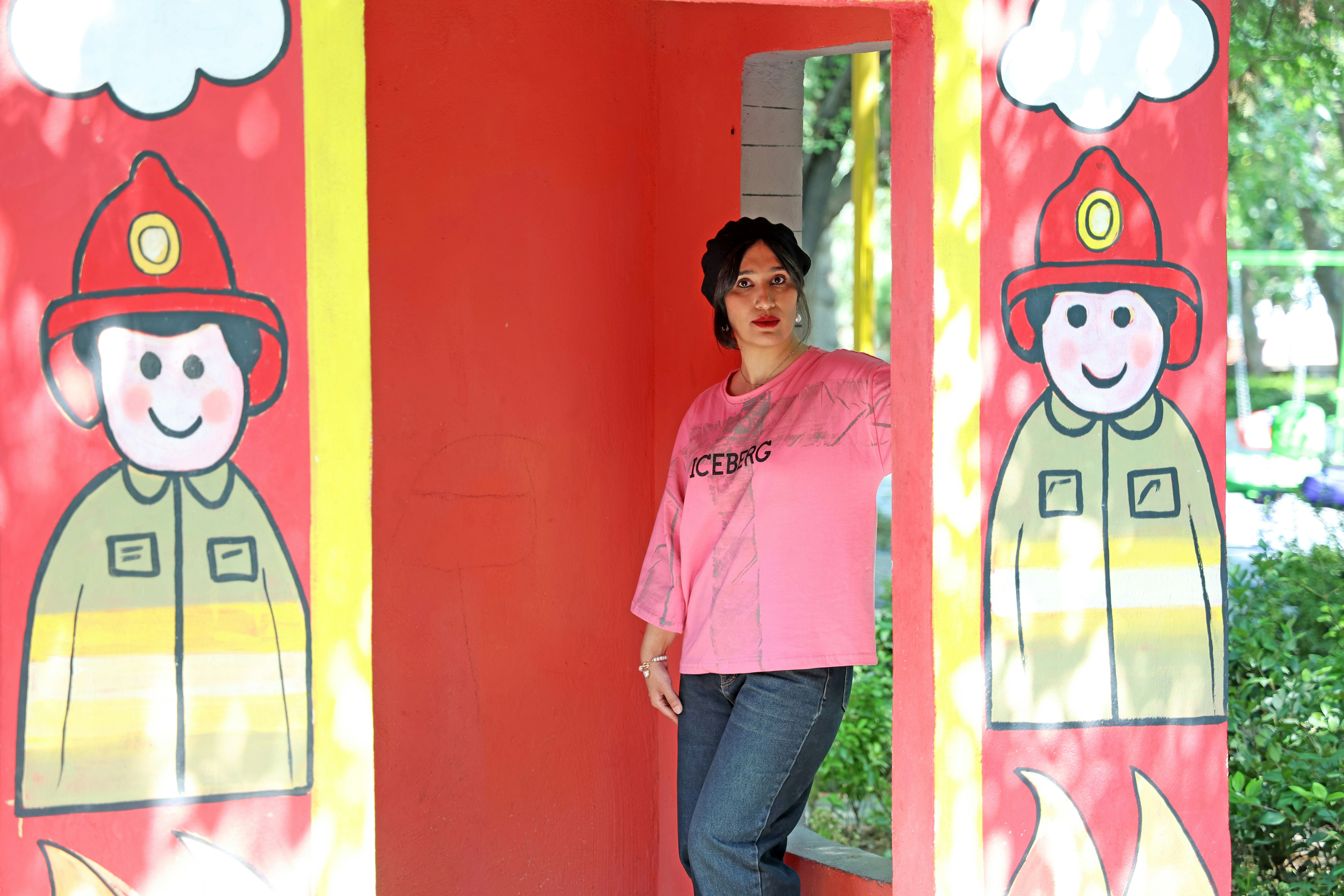 Pink-sleeved Explorer at a Firefighter Photo Wall
