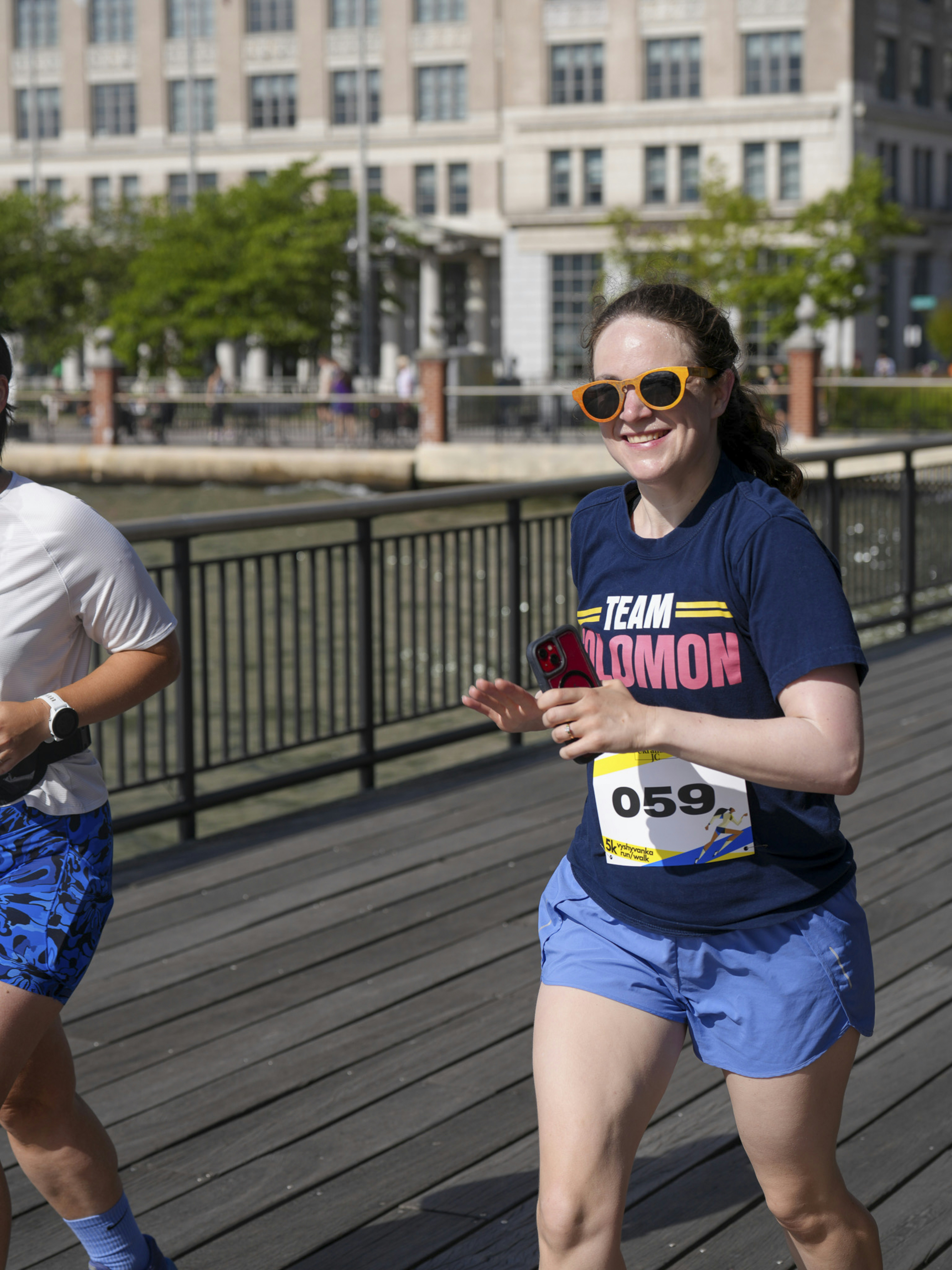 Runner in Blue: A Moment of Grit by the Riverfront