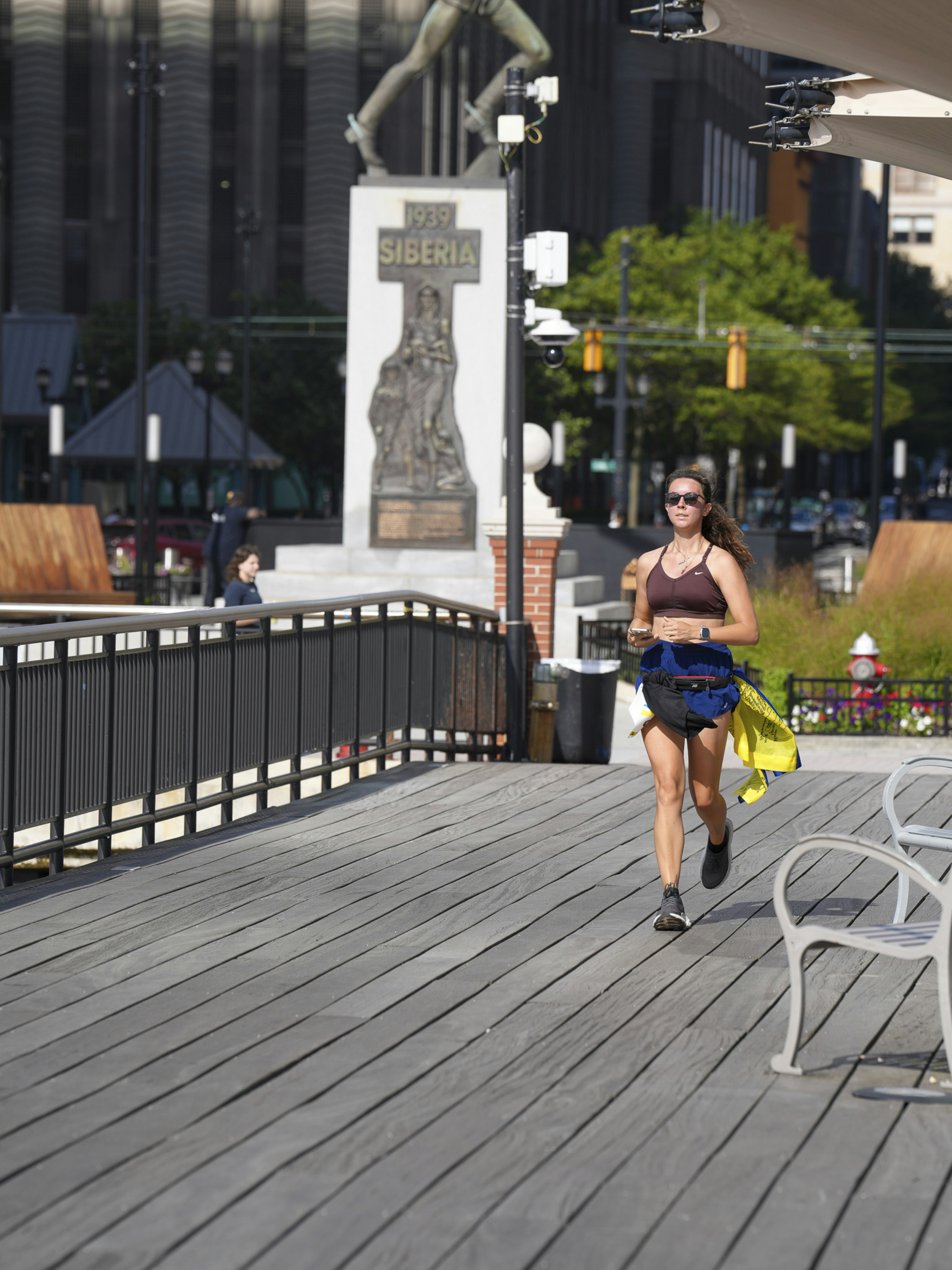 Runner in the Urban Boardwalk: A Moment of Motion by the Waterfront