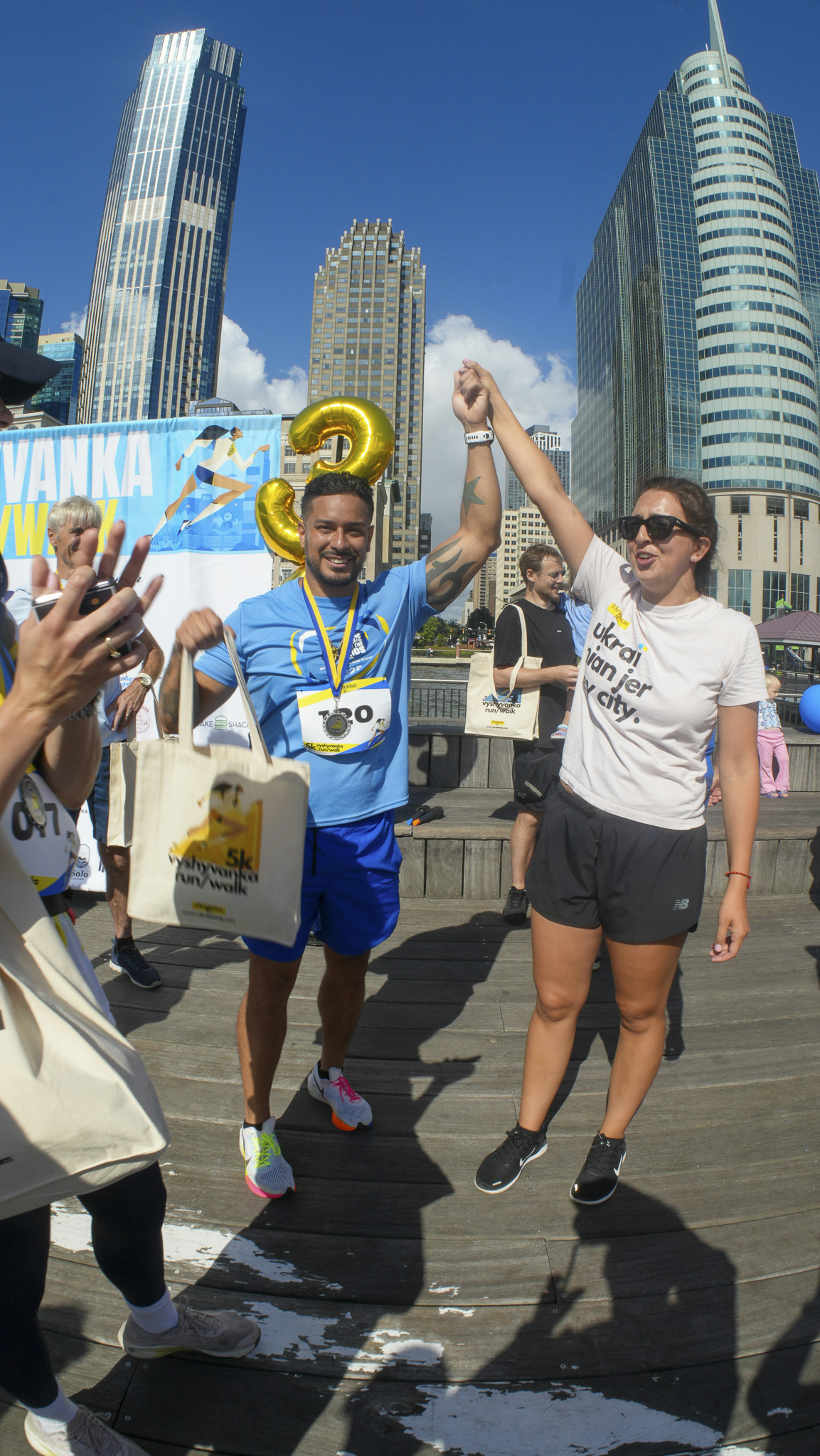 Victory at the City Run: Raising Hands Under Skyscrapers
