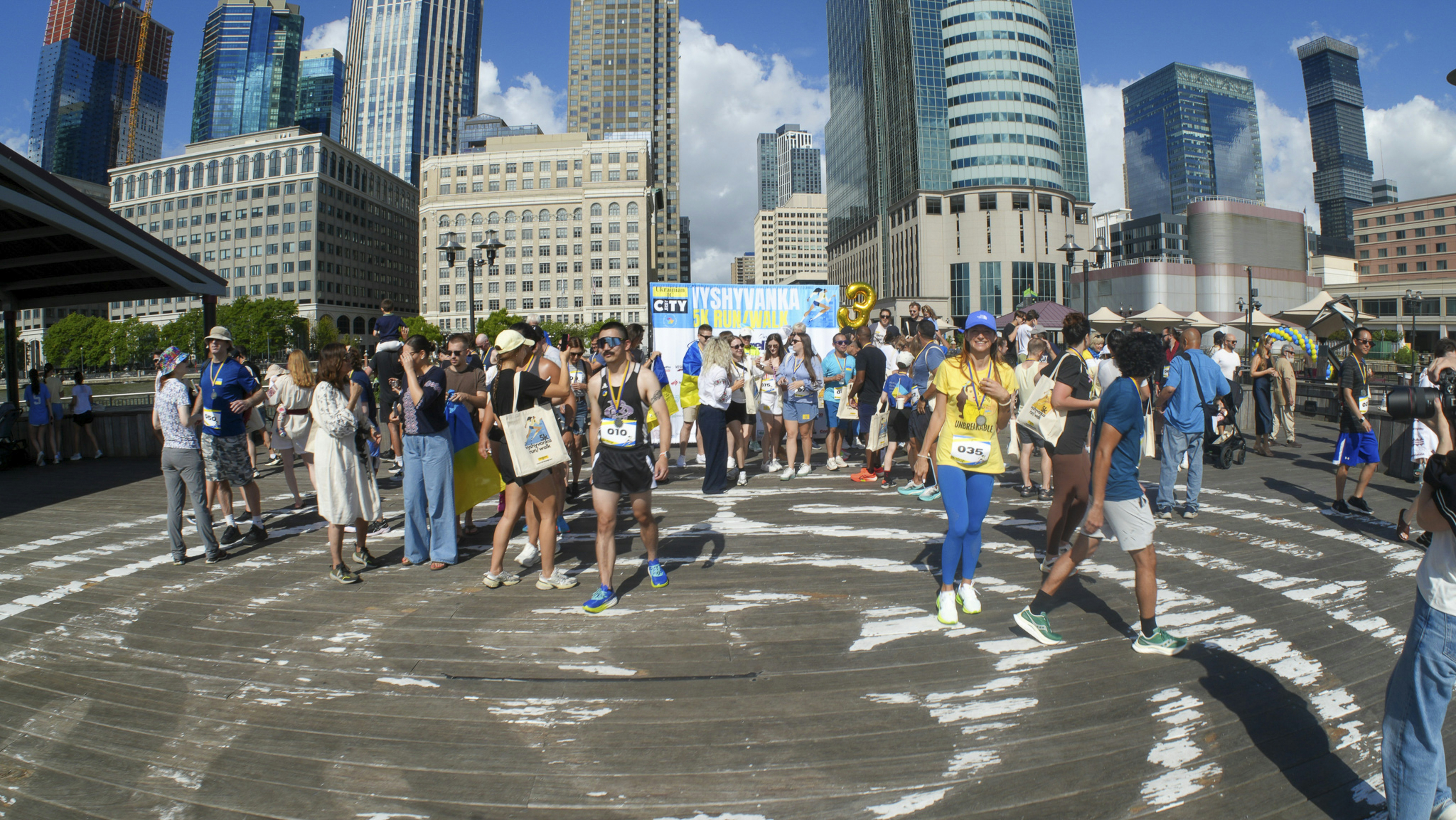 Crowd Rally at a City Waterfront Plaza