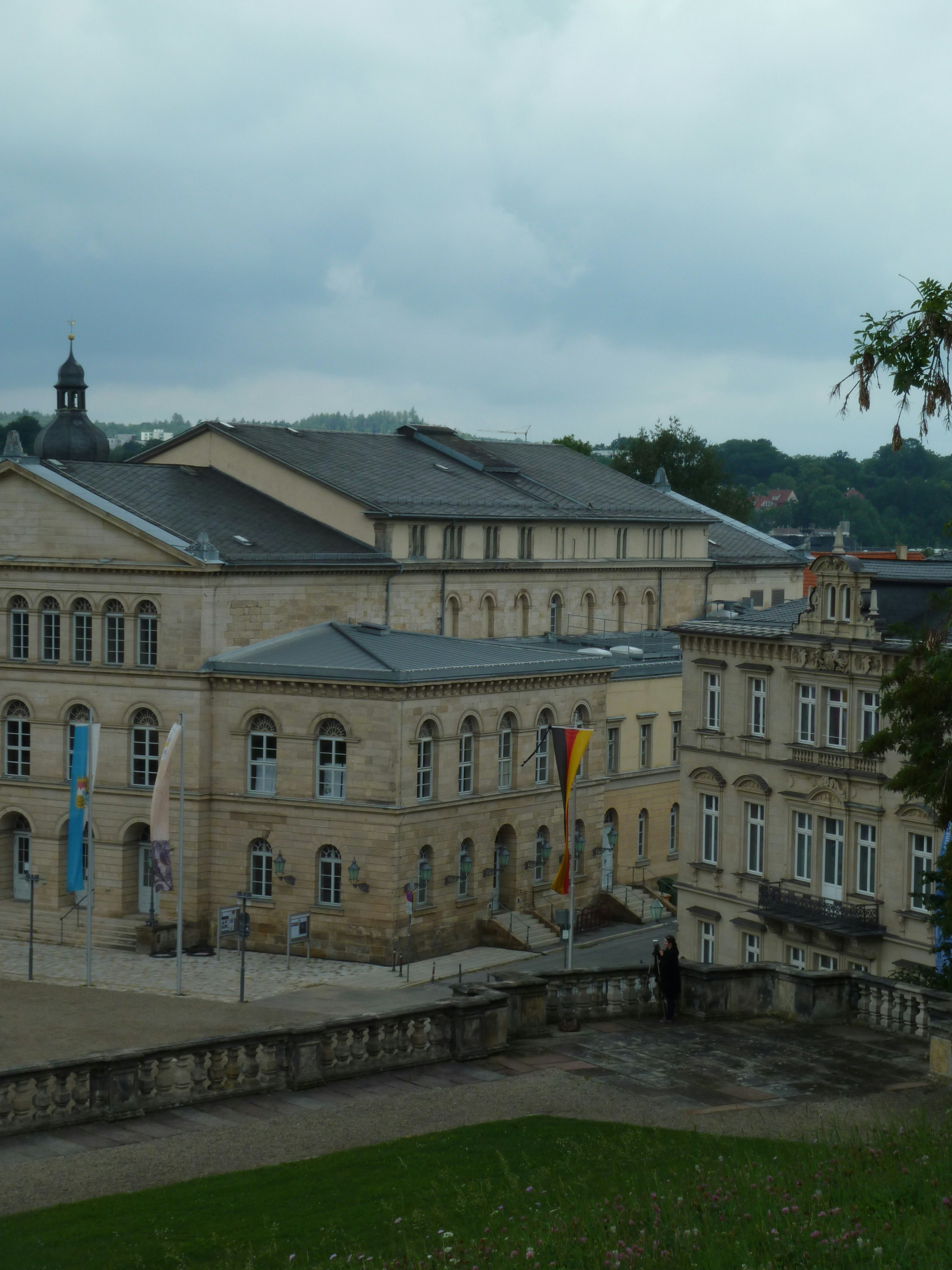 Stone Facades and Quiet Cobblestones: A Historic Square Under Overcast Skies