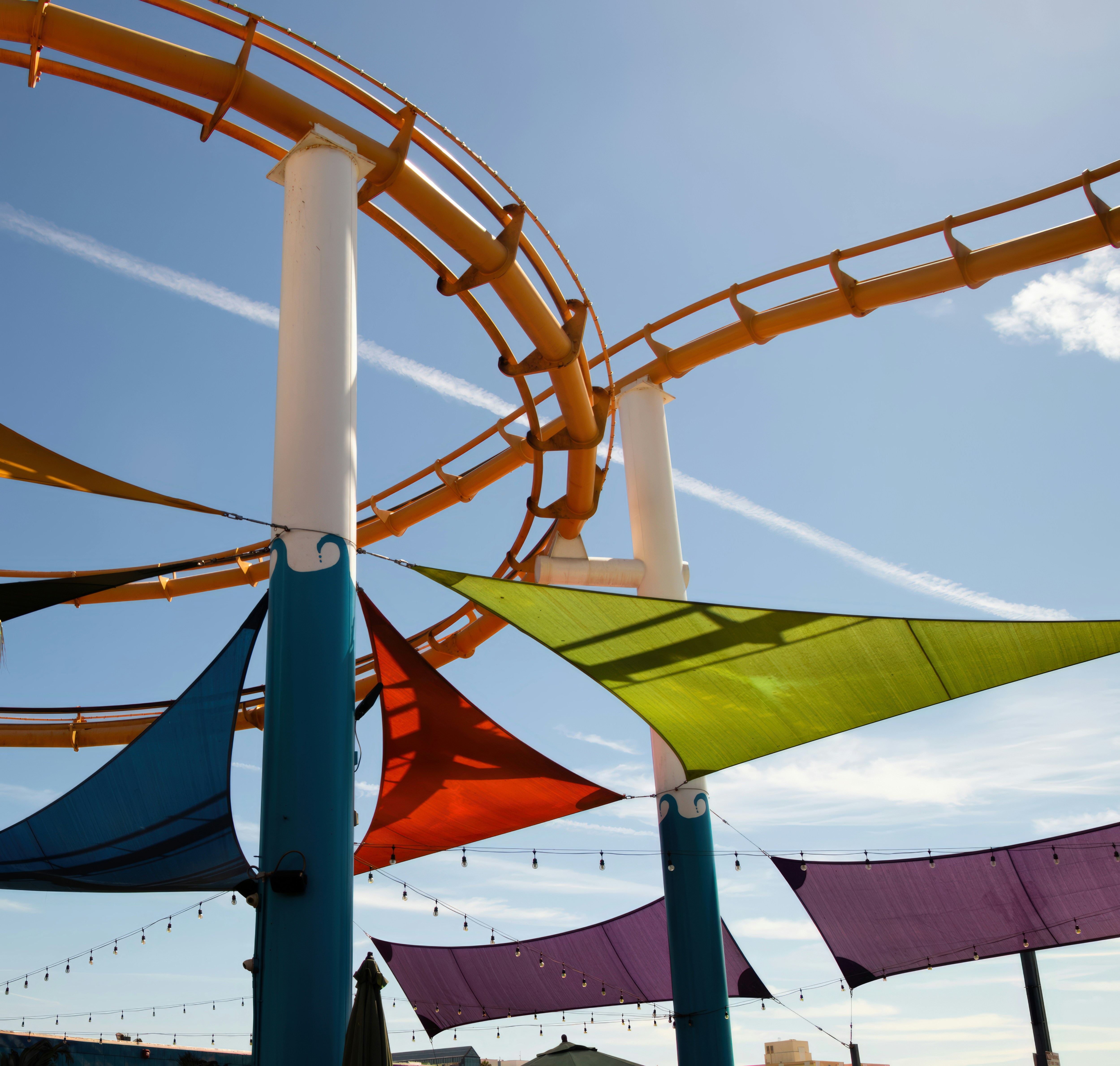 Splash of Color Beneath a Whirling Orange Track