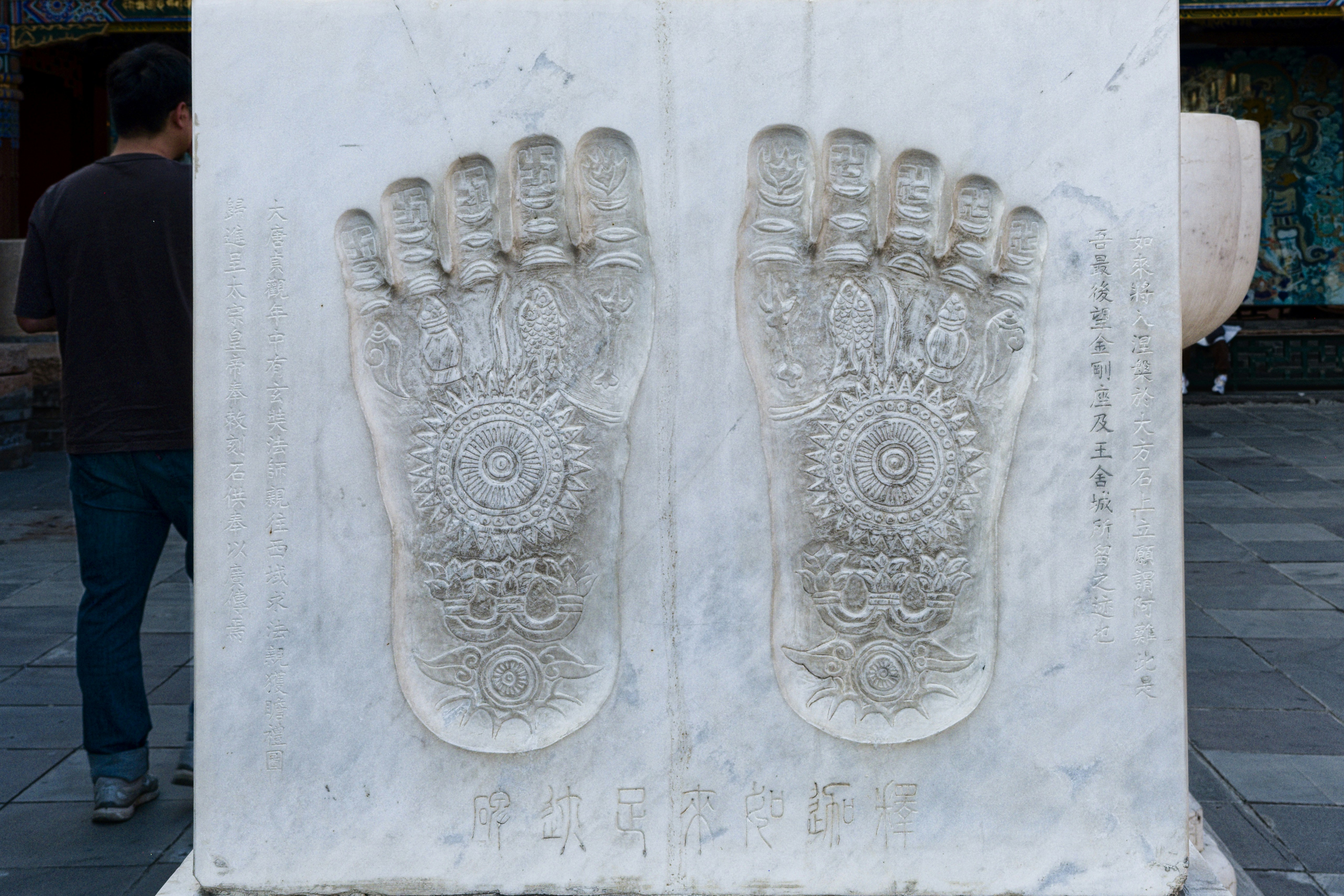 Two Handheld Echoes: A Carved Footprint Portrait in Marble