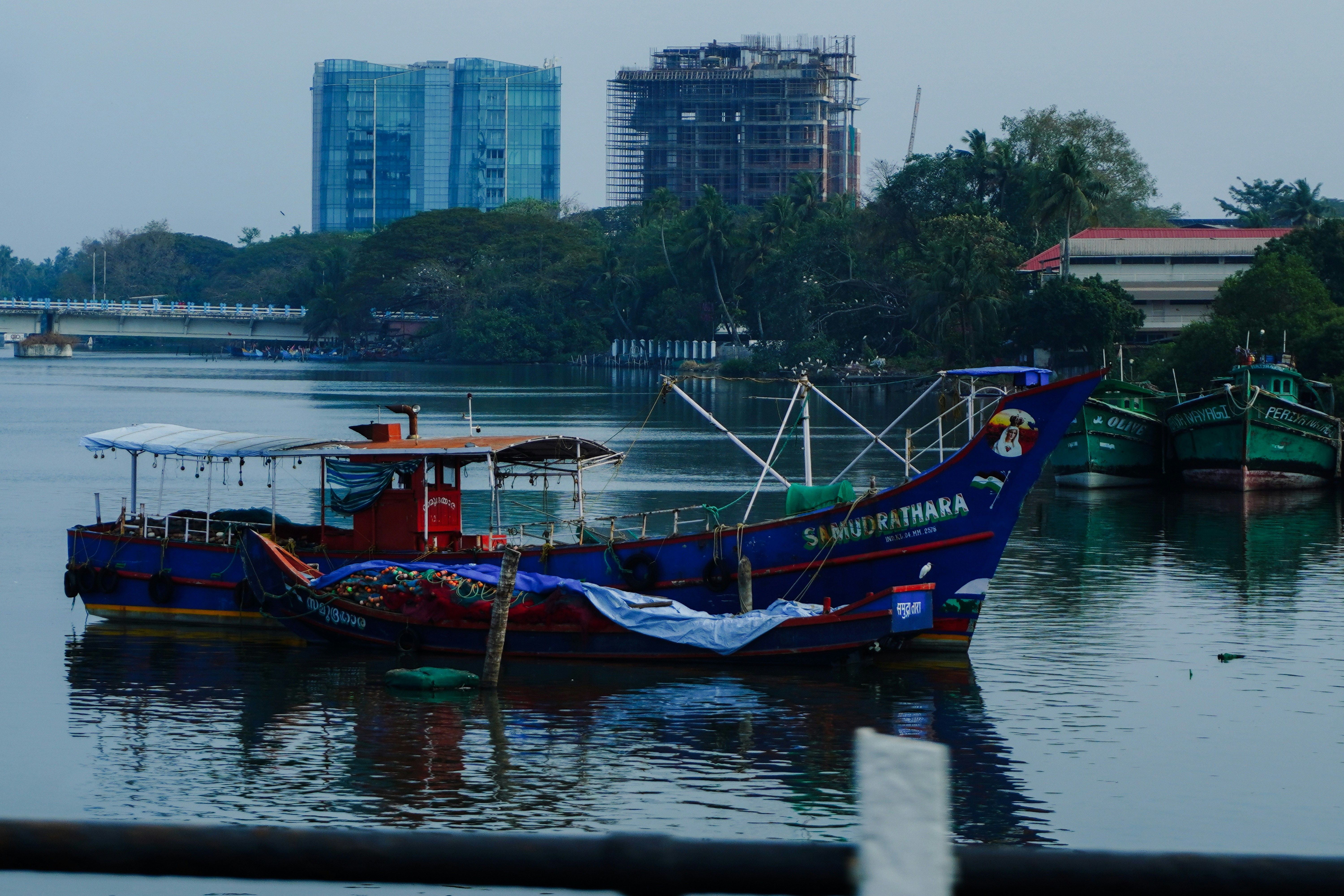 Colorful Fishing Barge Convergence on a Calm River