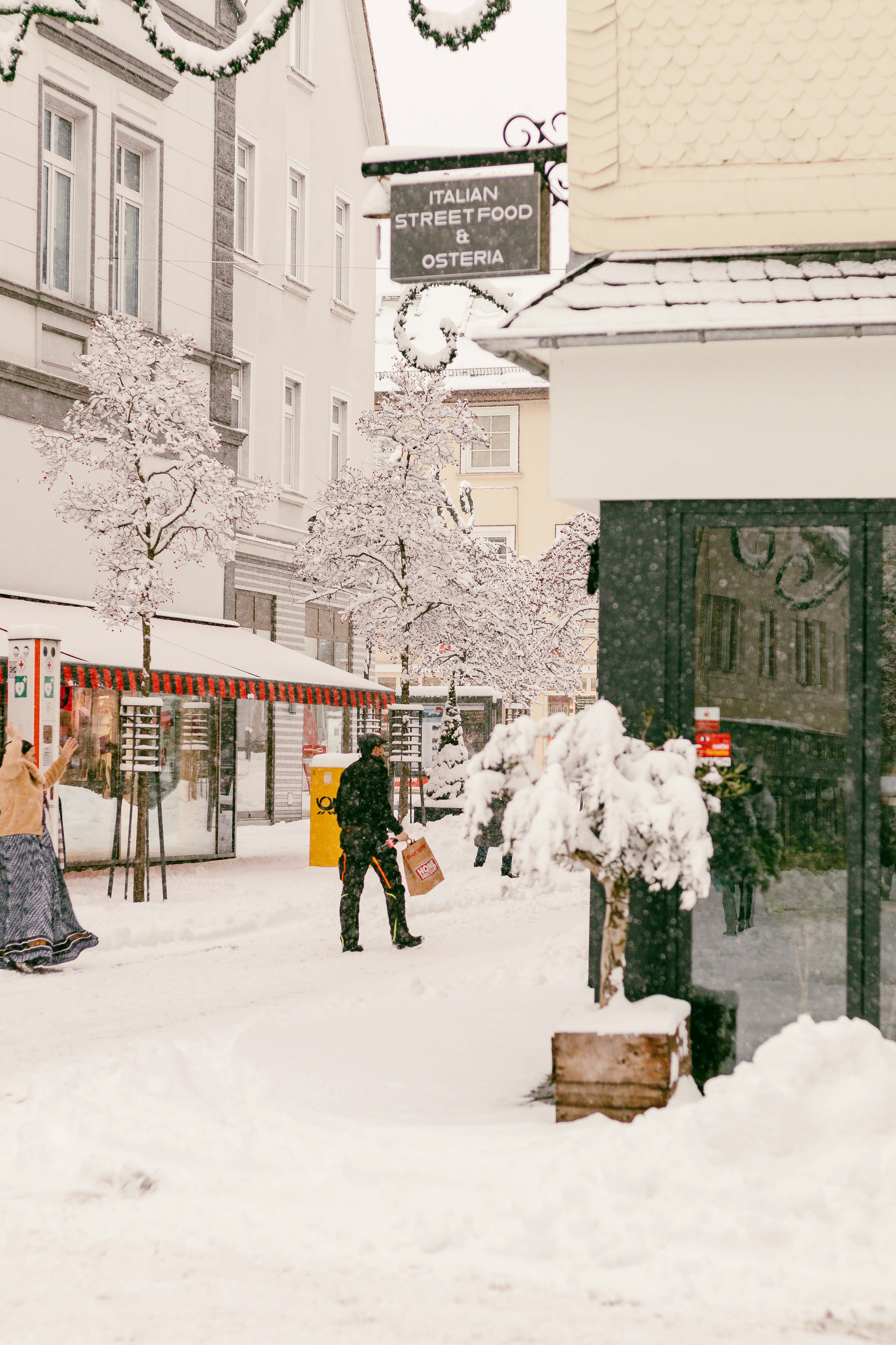Snow-Covered Street in a European Town Center
