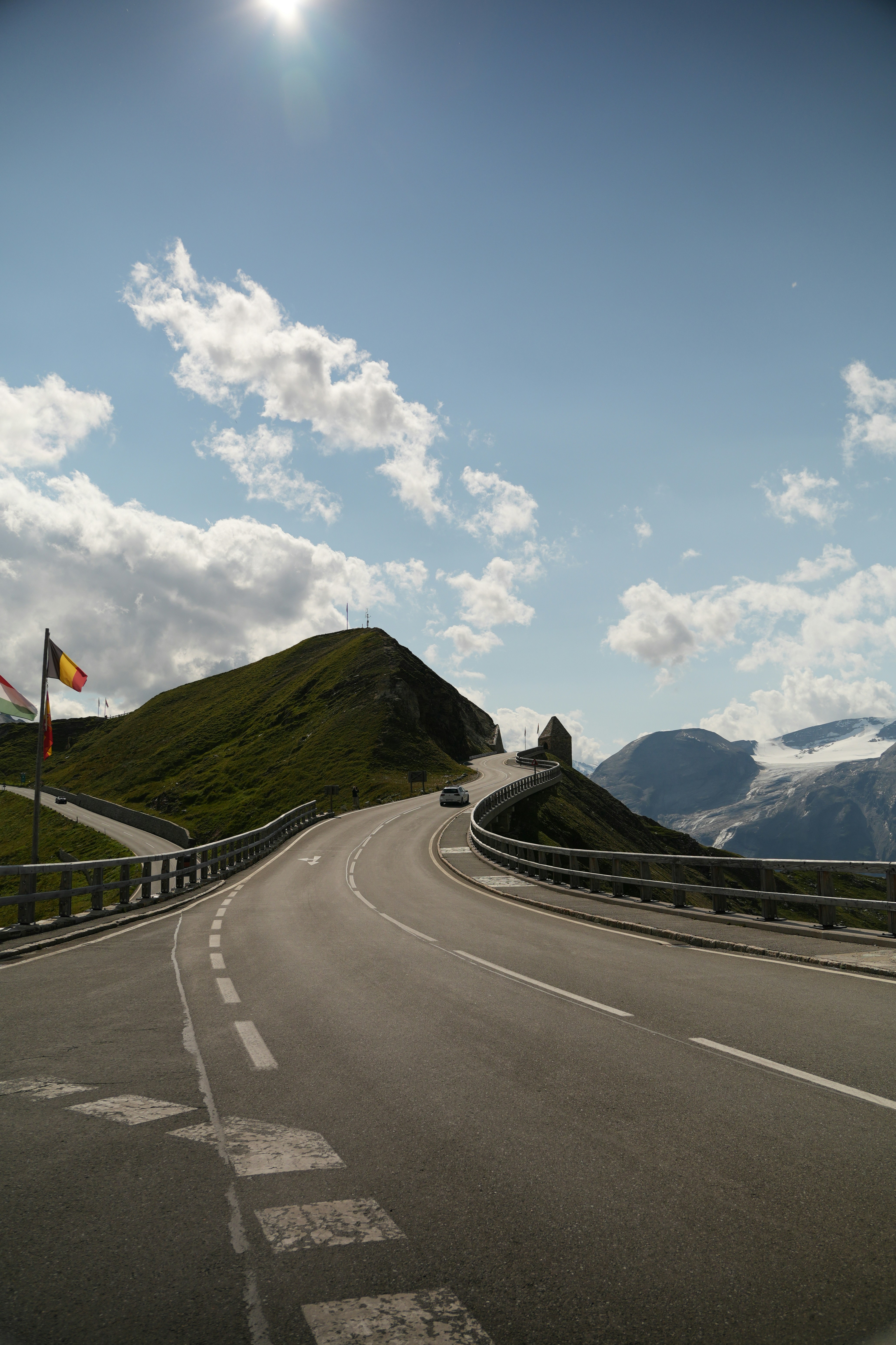 Highway to the Ridge: A Mountain Pass under a Wide Sky