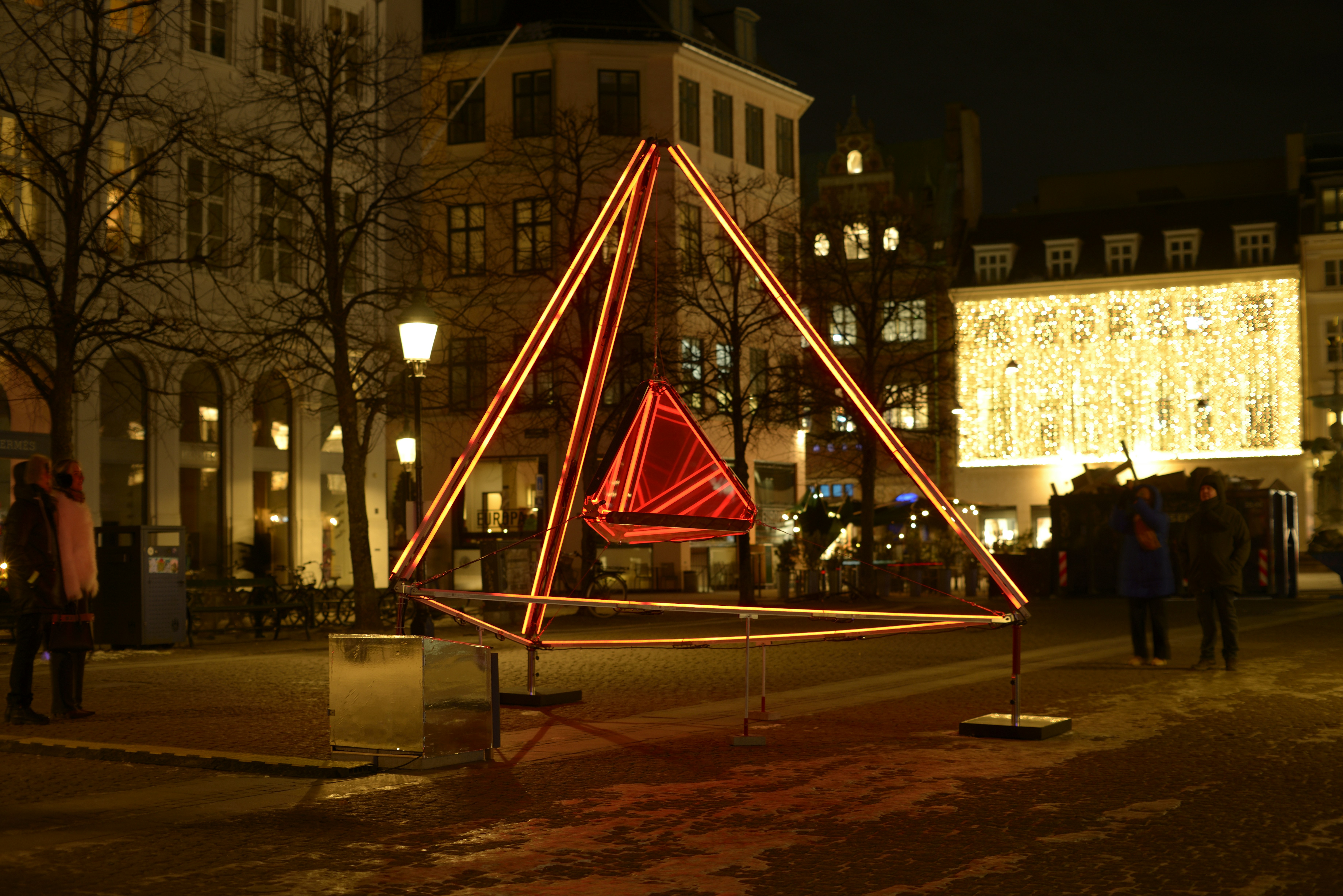 Neon Pyramid in the Night Square
