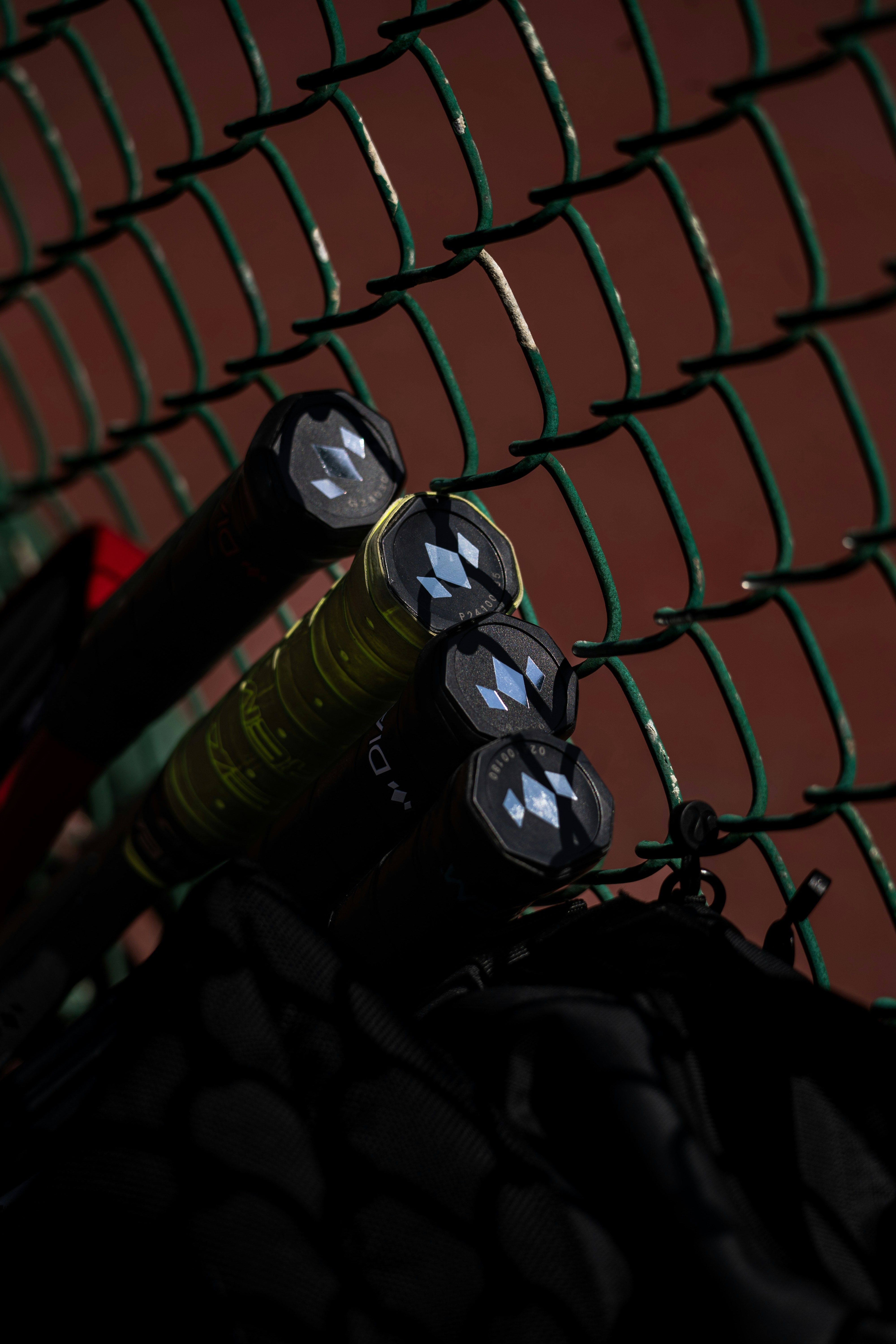 Battered Green Fence Meets Chalky Chalk of Climbing Gear