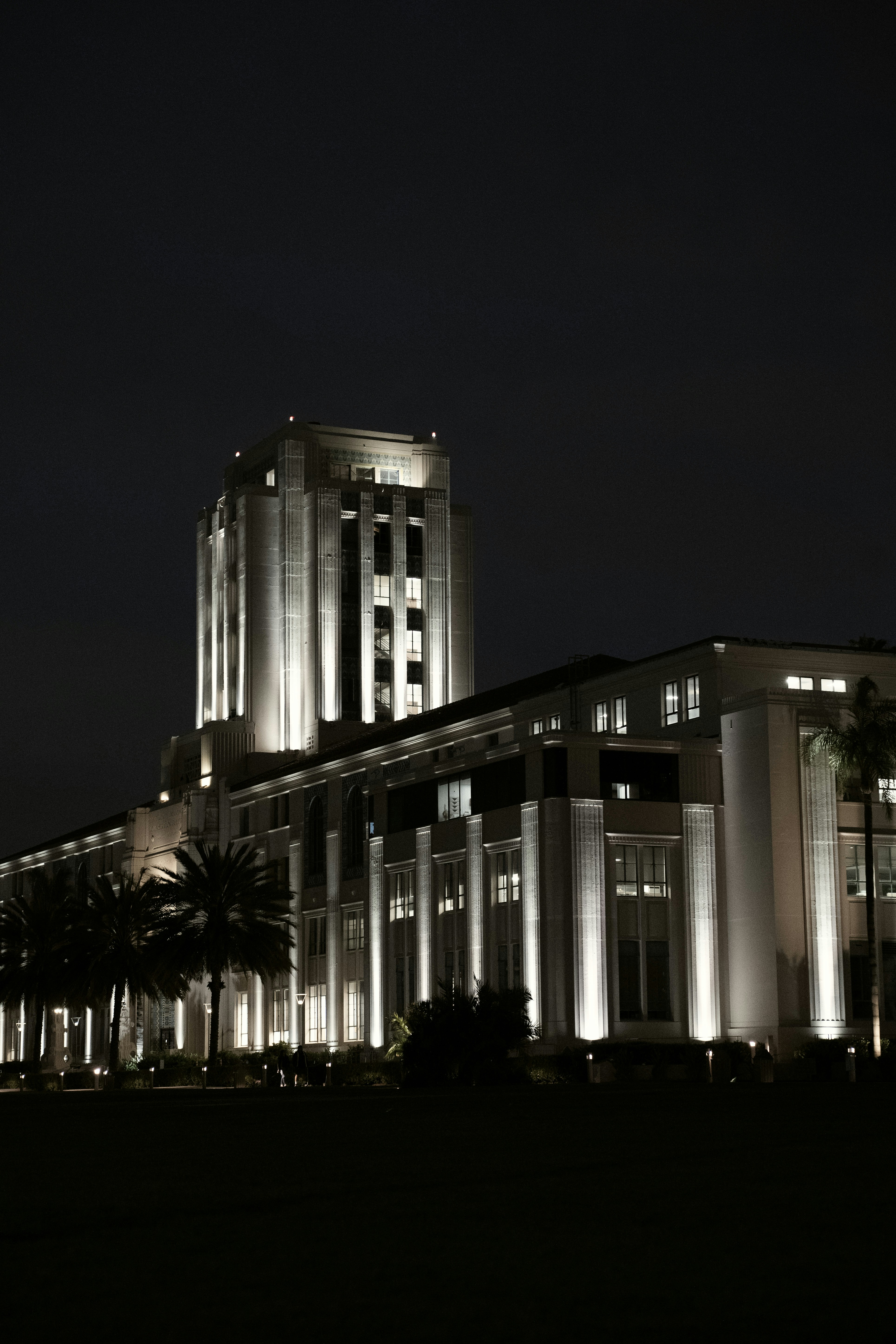 Nighttime Columns: Illuminated Banking Hall rises from the darkness