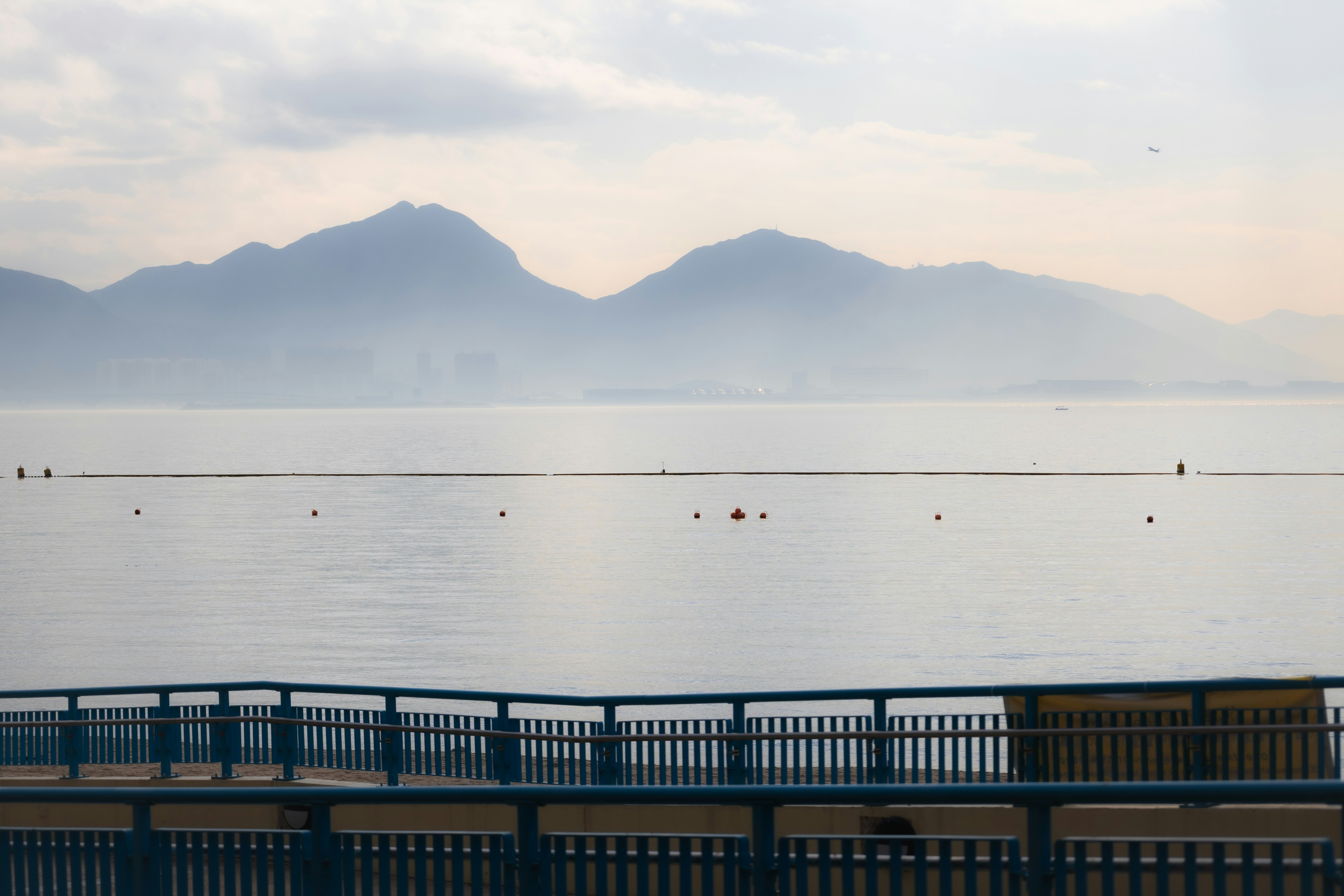 Misty Lake Promenade Under Quiet Mountains