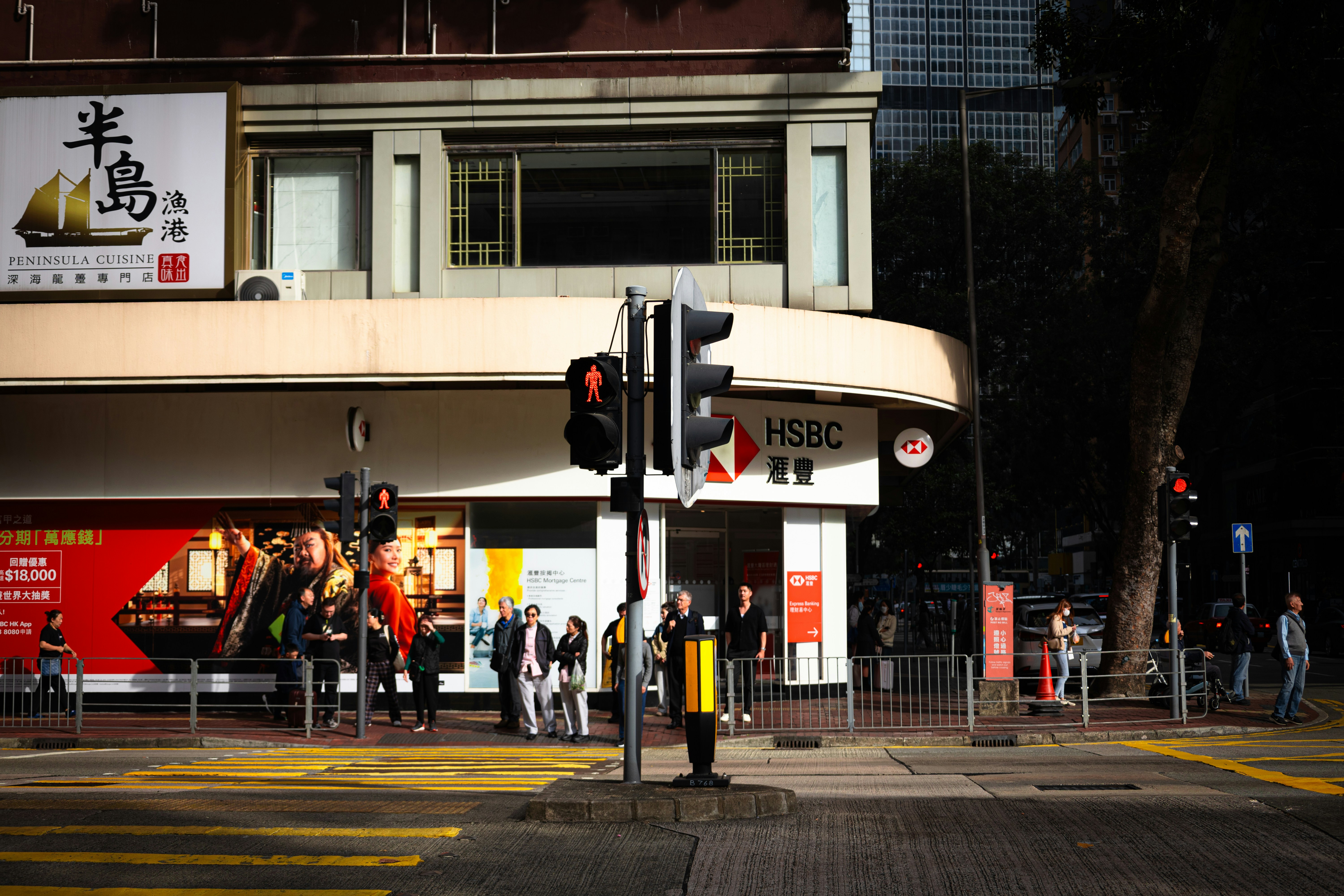 Crosswalk Spotlight: Pedestrians and storefronts in a city corner