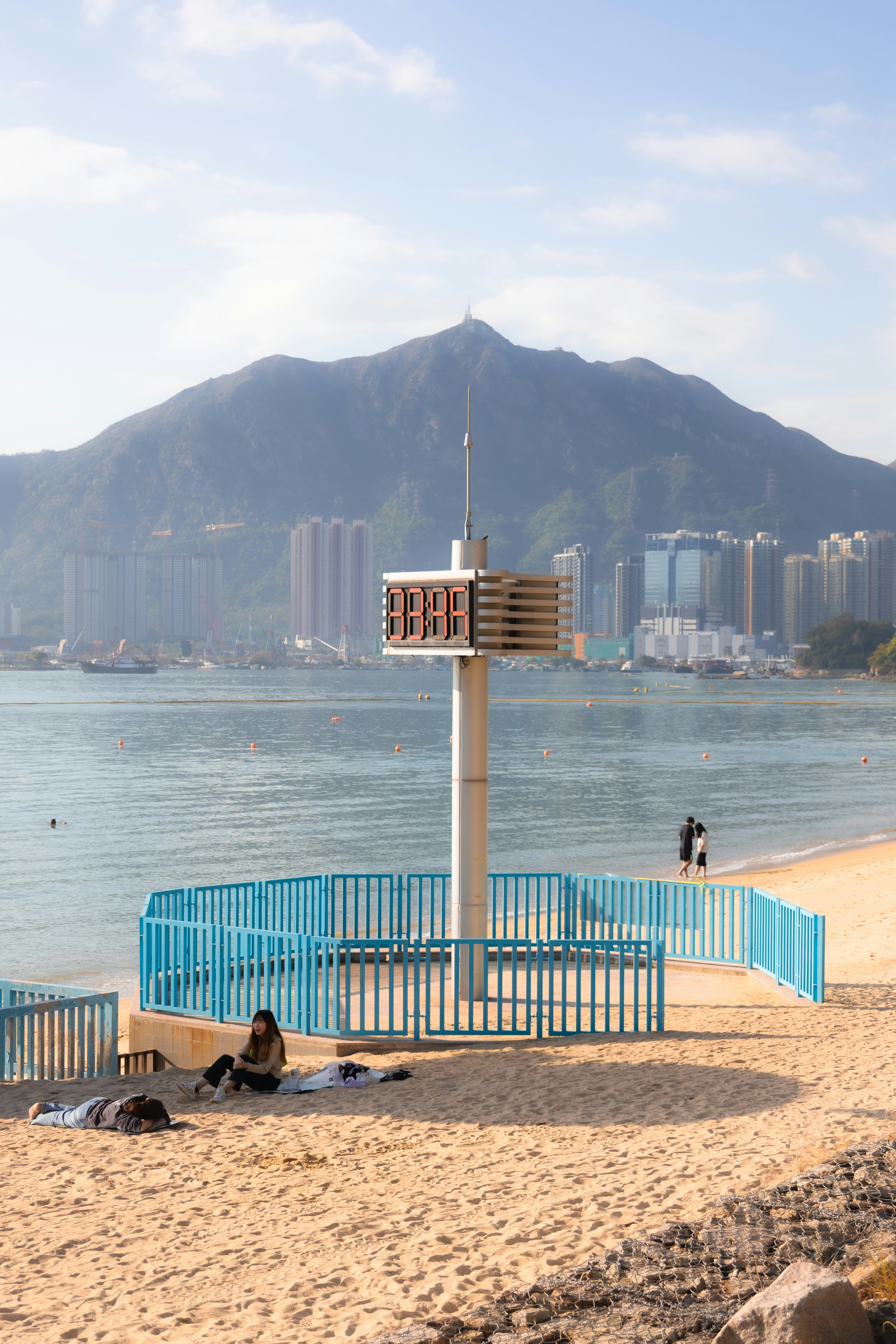Blue Railing at the Beach Clock Tower with Mountain Backdrop