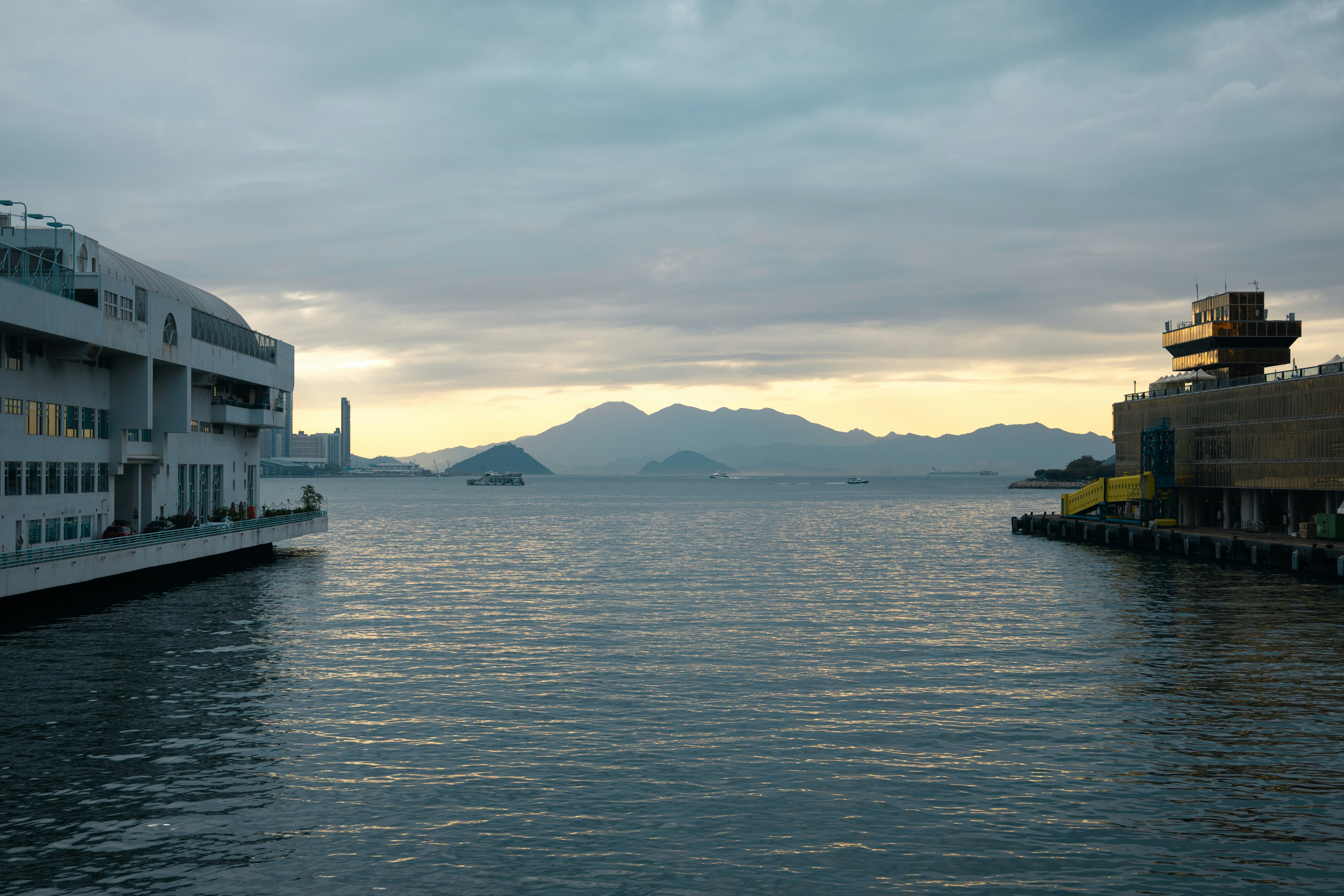 Harbor Gap at Dusk: Boats, Water, and Distant Mountains