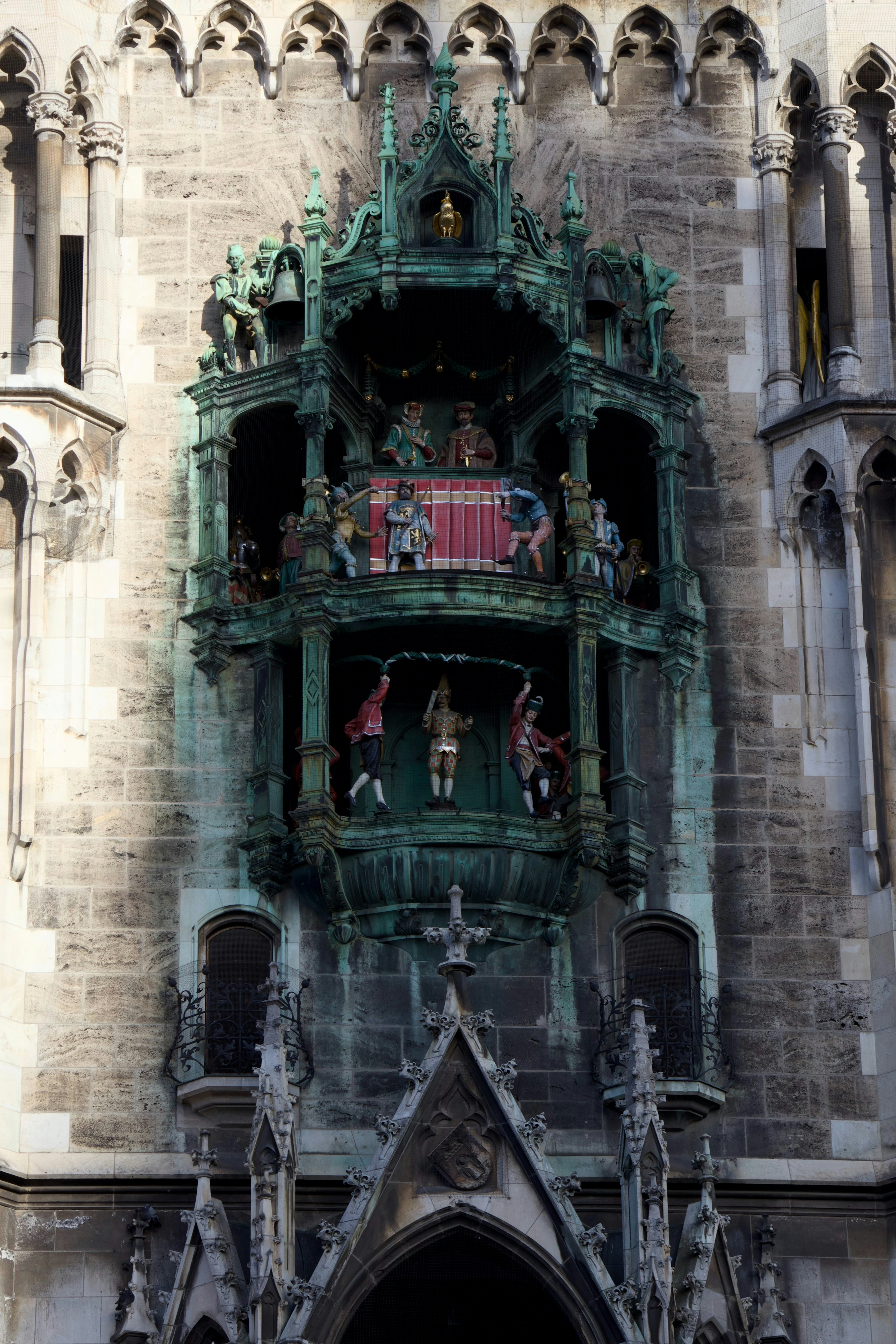 Green Gothic Carillon: Figures in Time On a Stone Facade