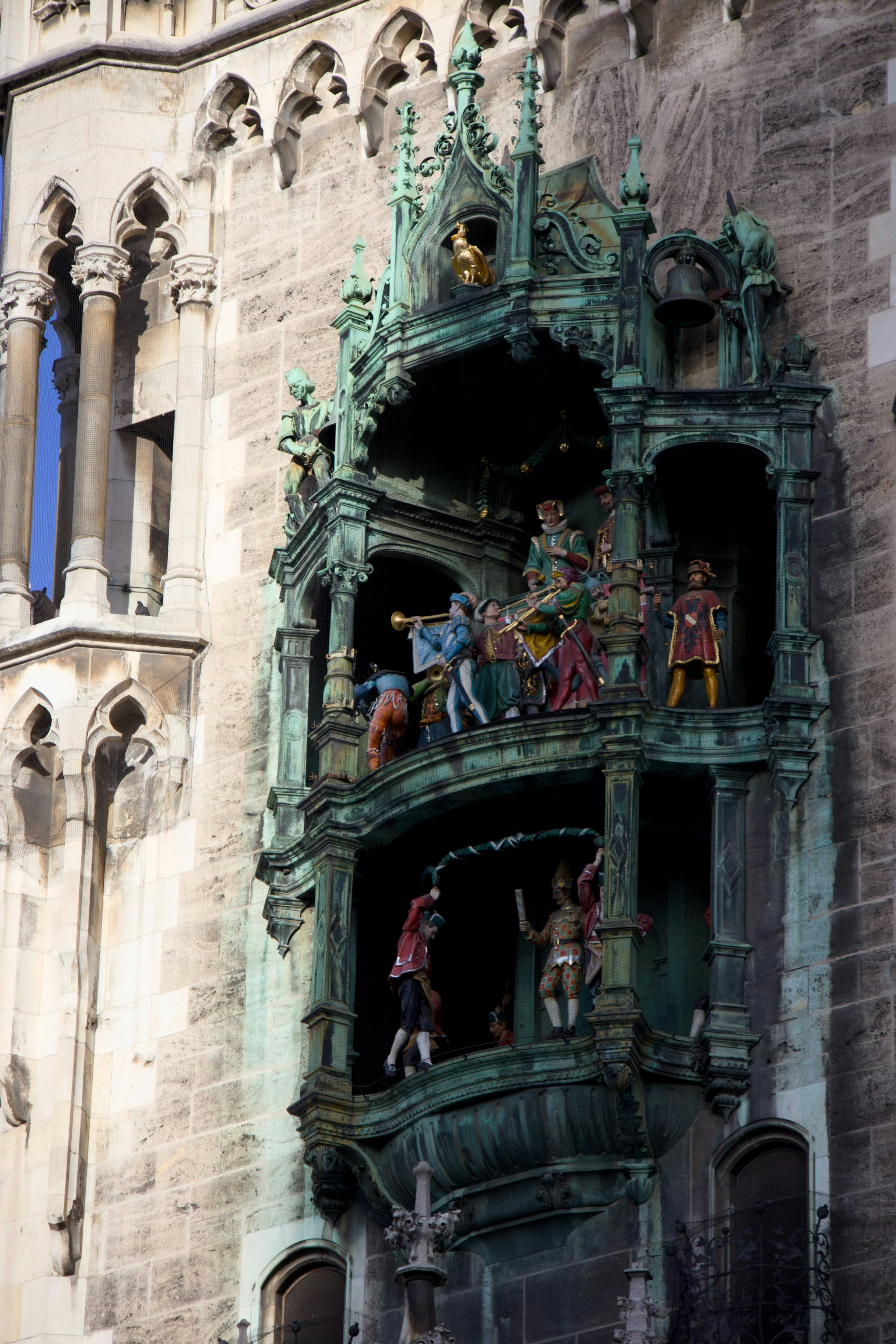 Gothic Mechanisms: Clockwork Figures Adorning a Cathedral Facade