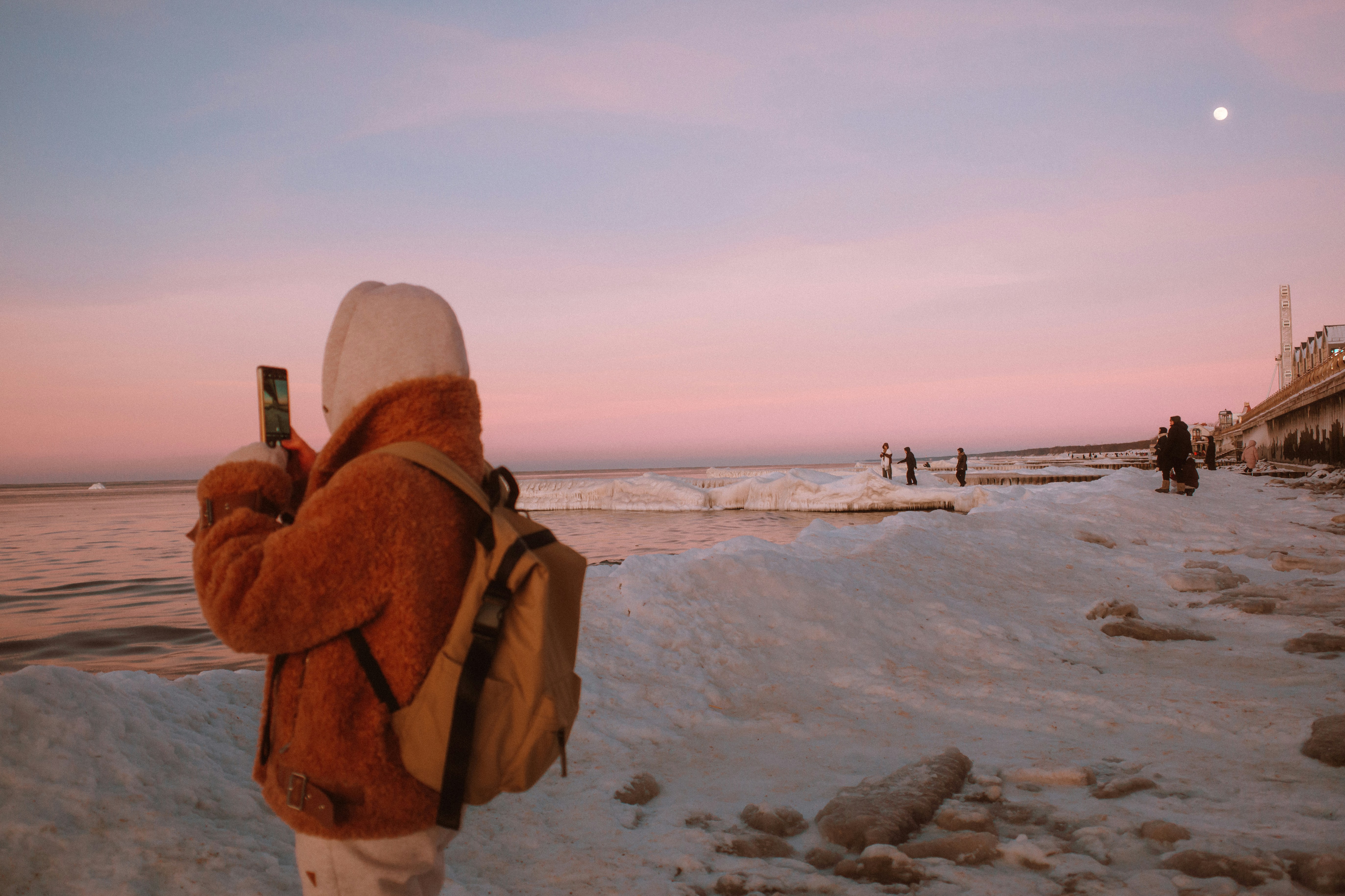 Snowbound Photographer at the Seaside Twilight