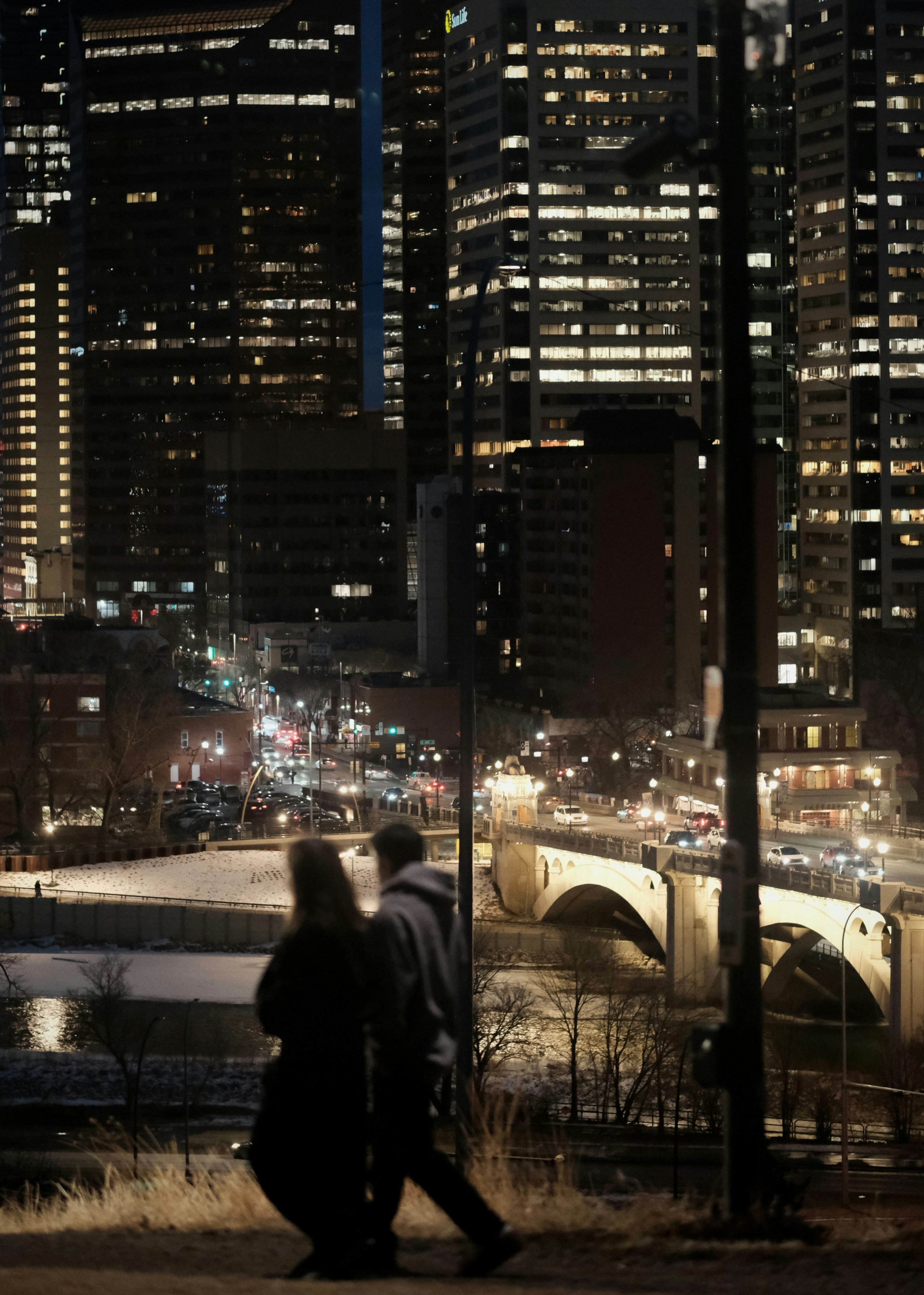 Night Walk Along the Riverway Under City Lights