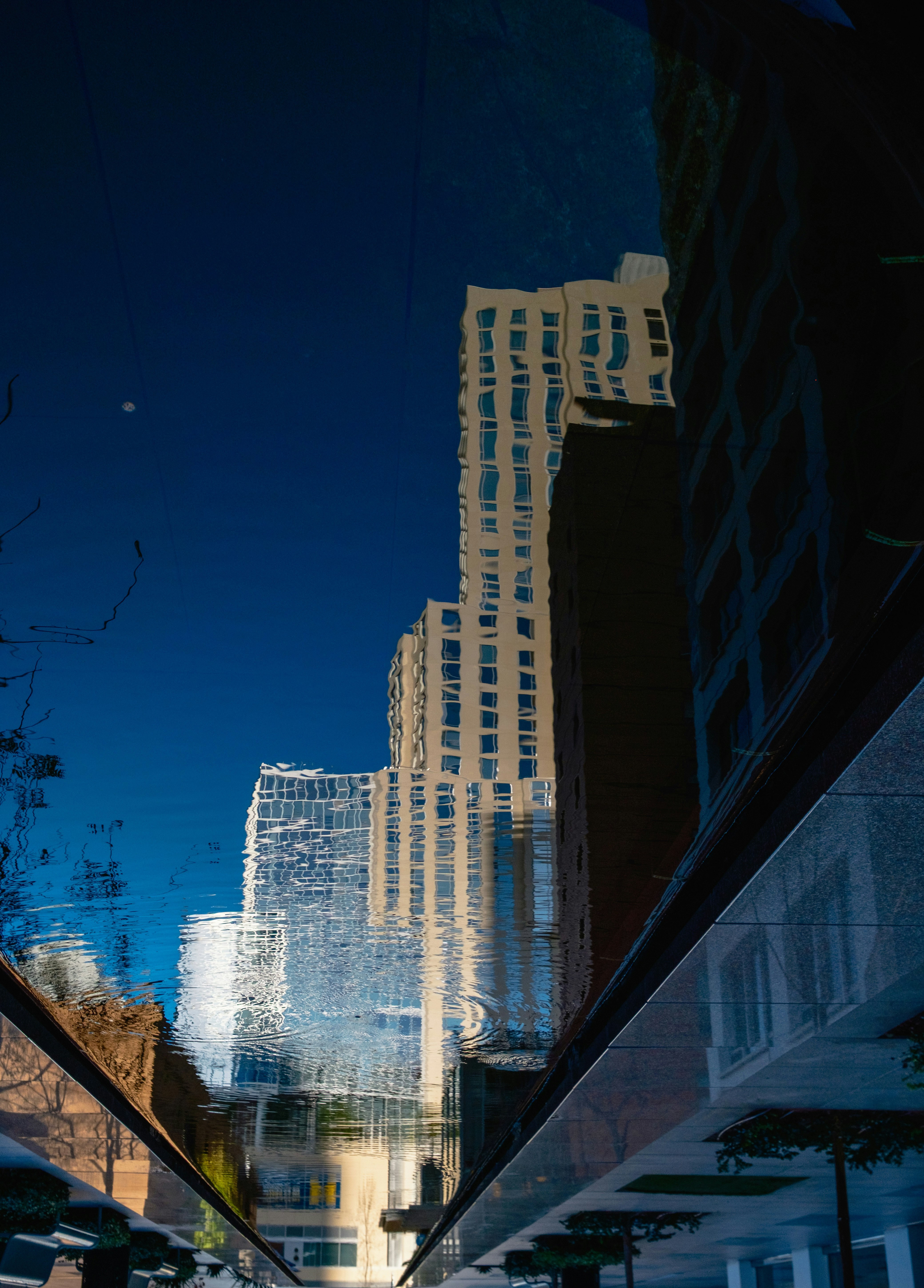 City Reflections: Skyscrapers Meld Into a Tinted Sky