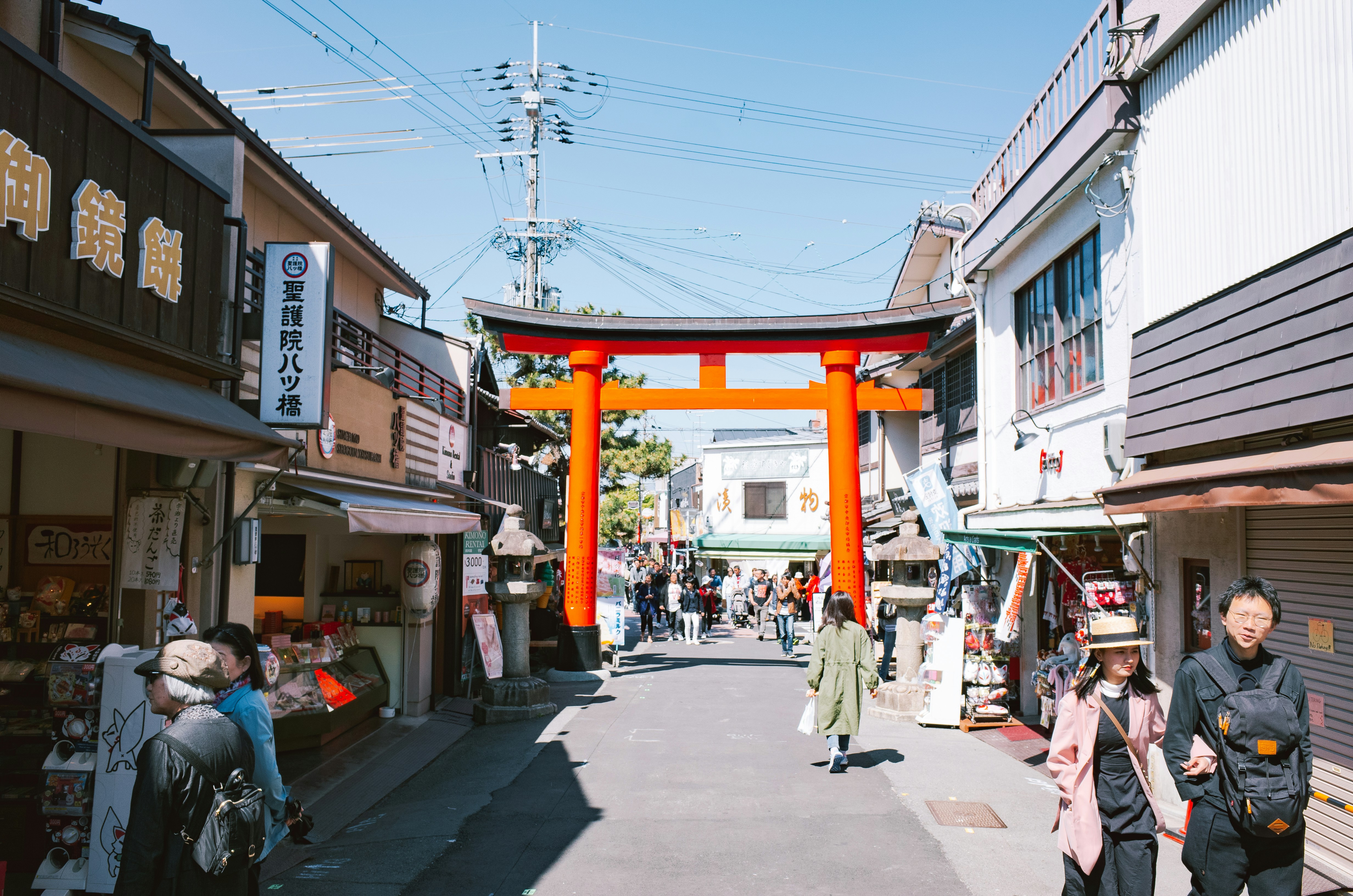 Gateway to the Market Corridor beneath a Crimson Torii