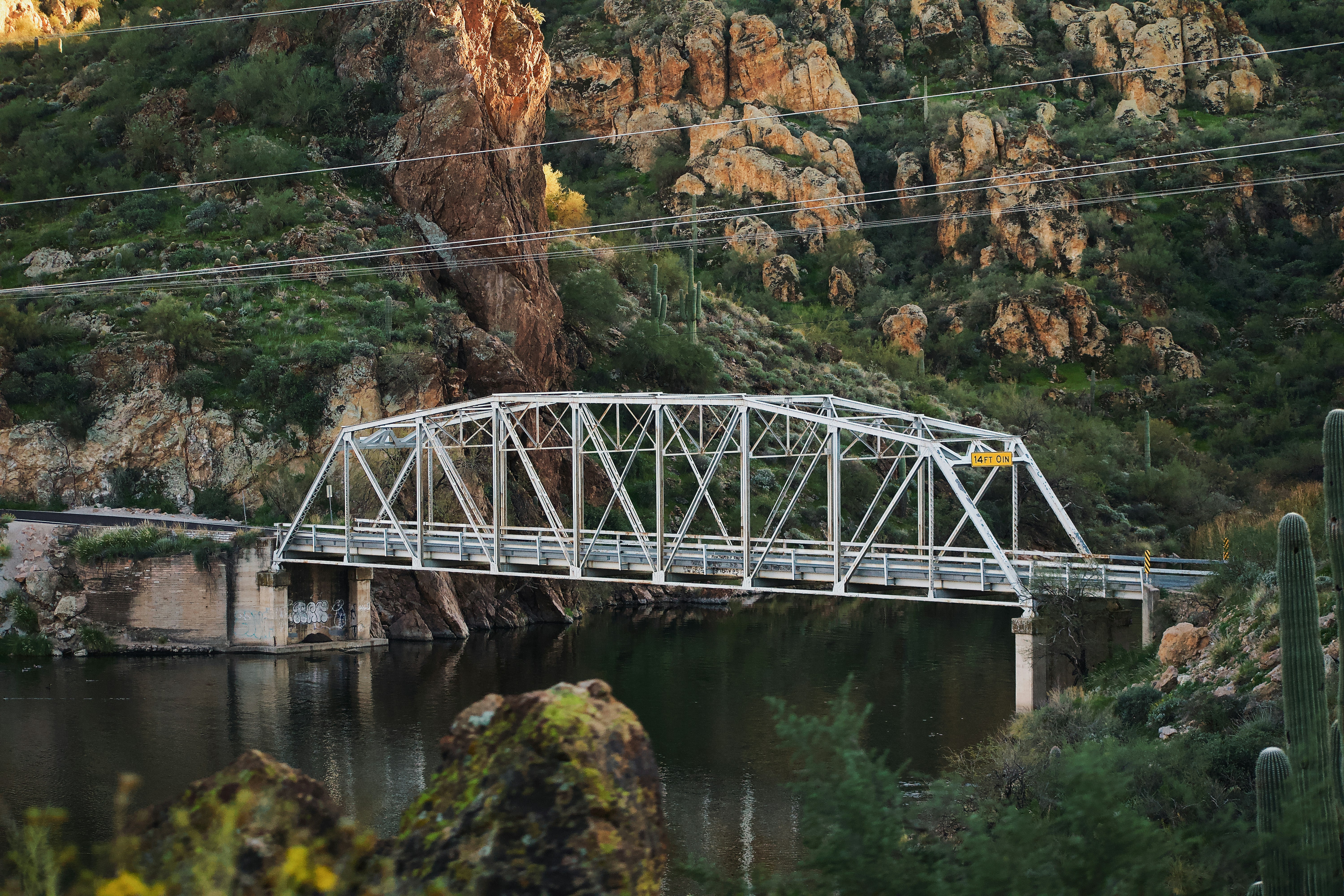 White Arch Bridge Cutting Through Rust-Colored Canyon