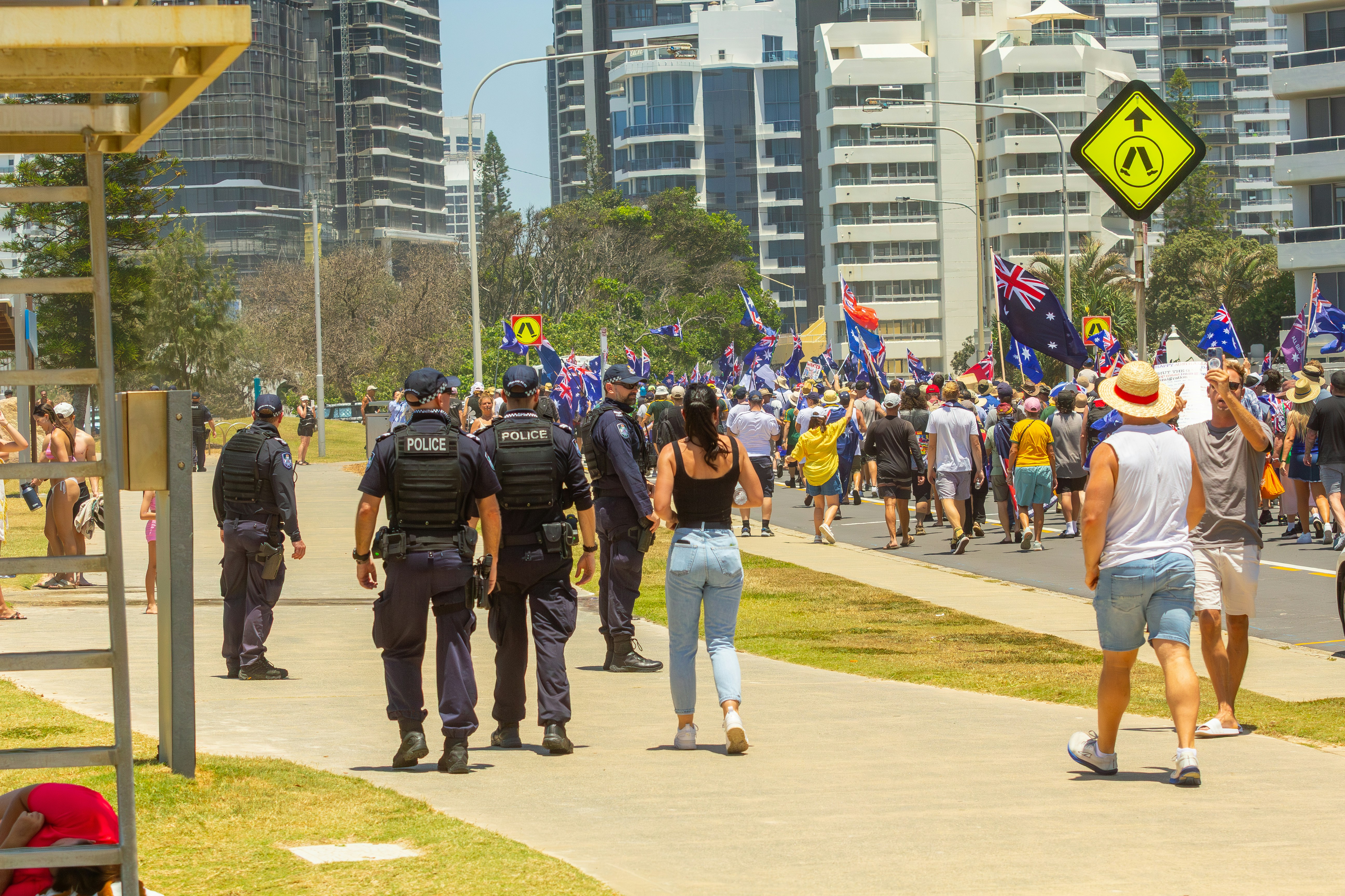 Police Escort Through the Park: A Demonstration Backs a Crowd