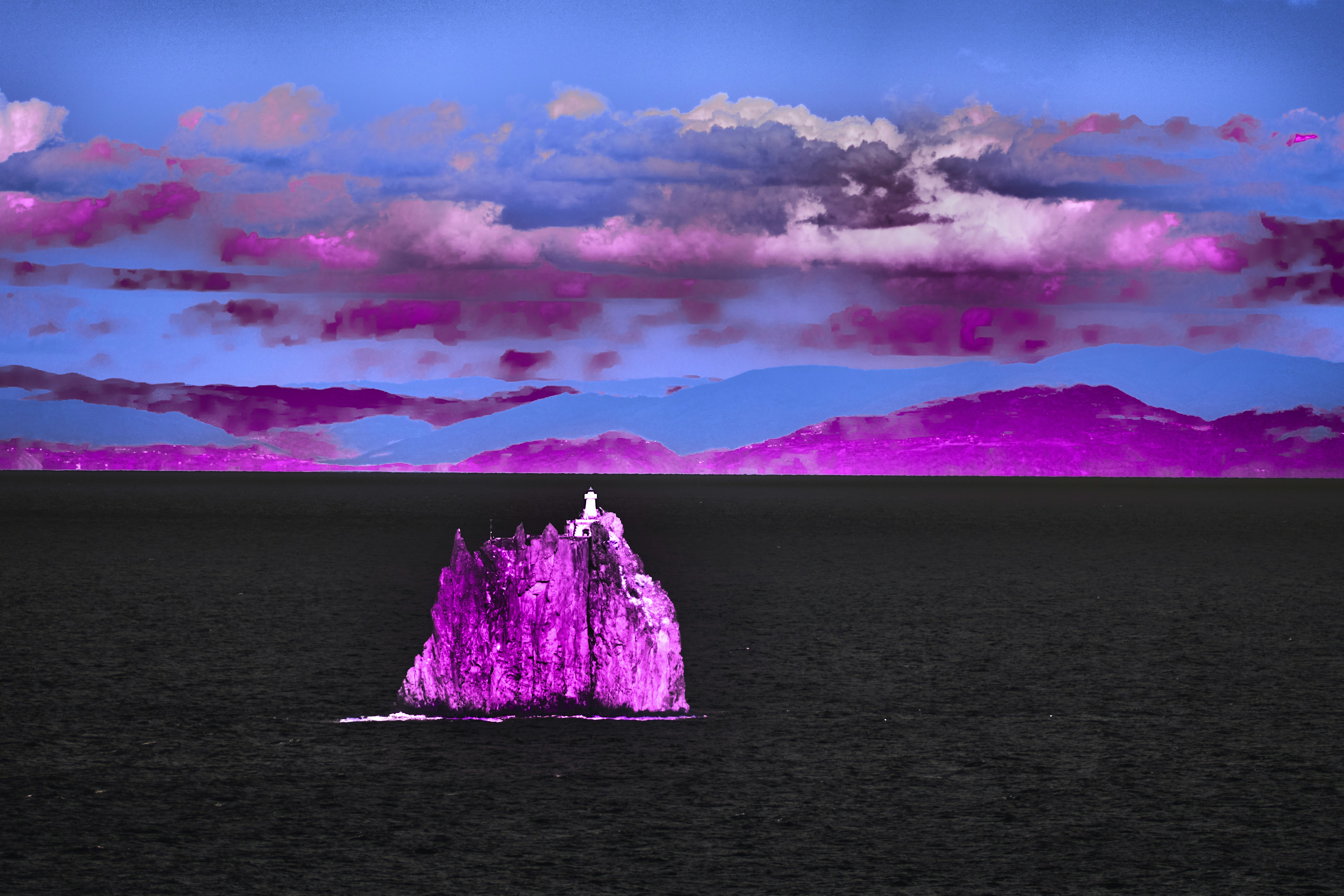 Magenta Isle: A Lone Peak Emerges from a Violet Sea