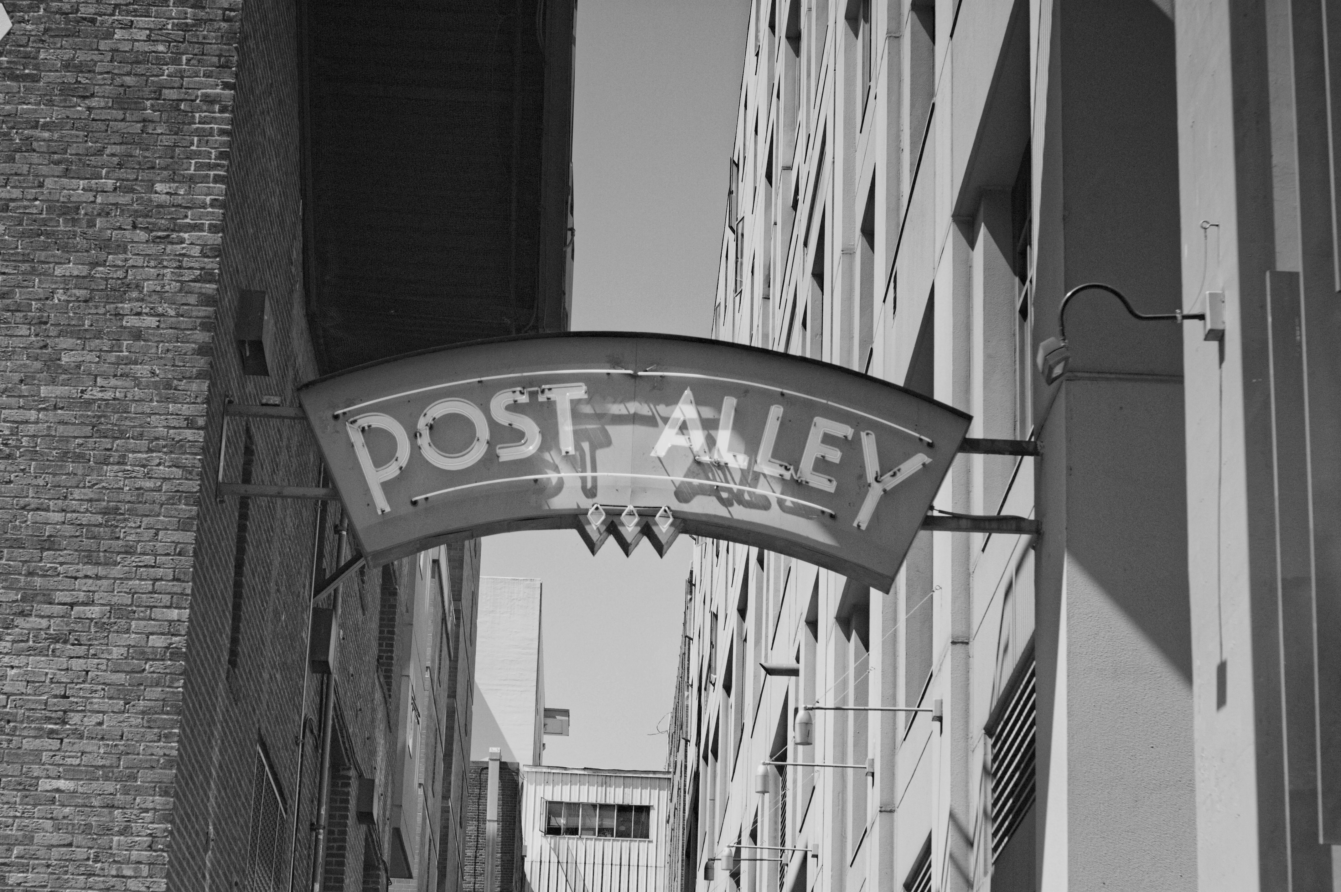 Post Alley Archway: Black-and-White Urban Passage