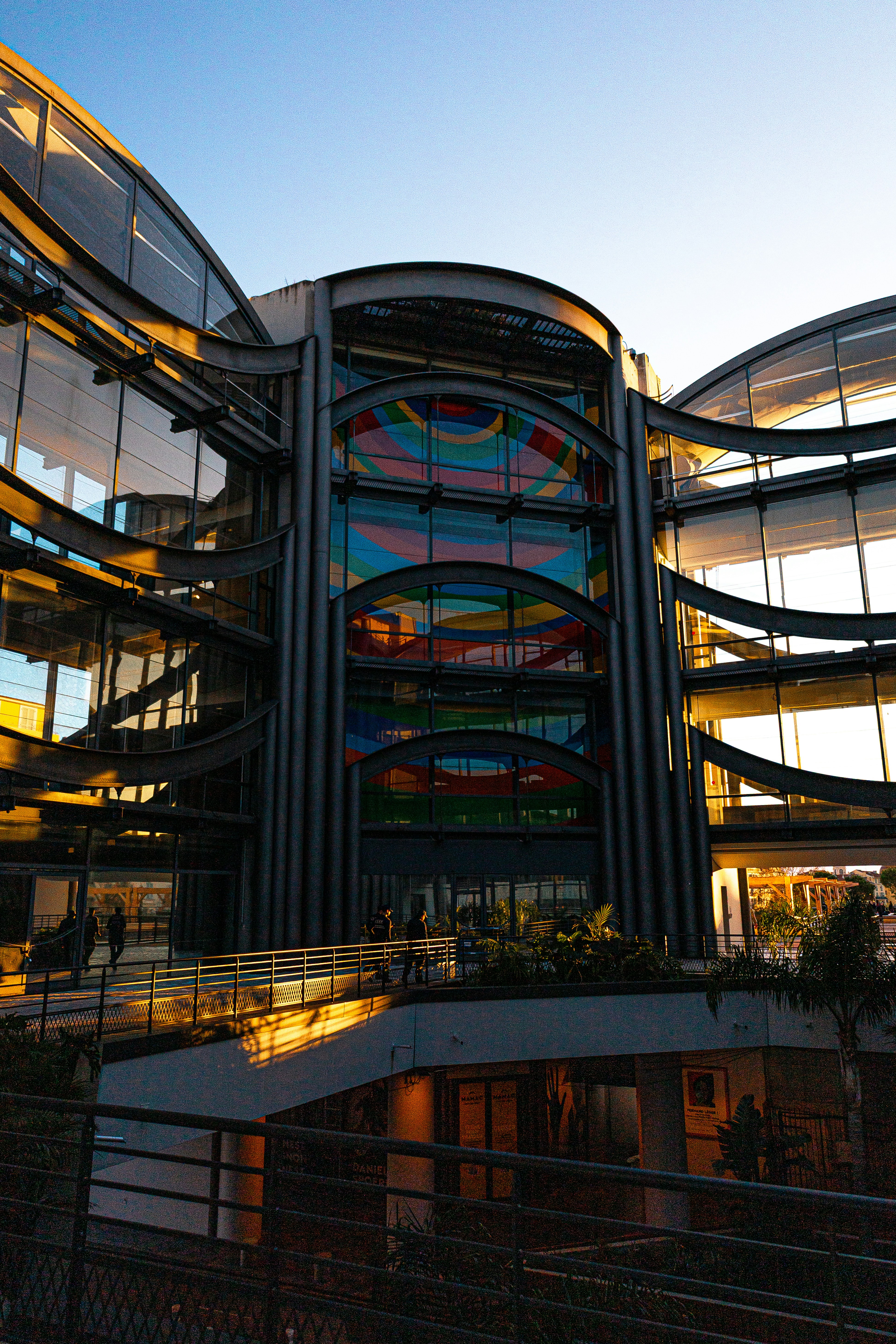 Sunlit Atrium: Glass, Steel, and Shadowed Ramps