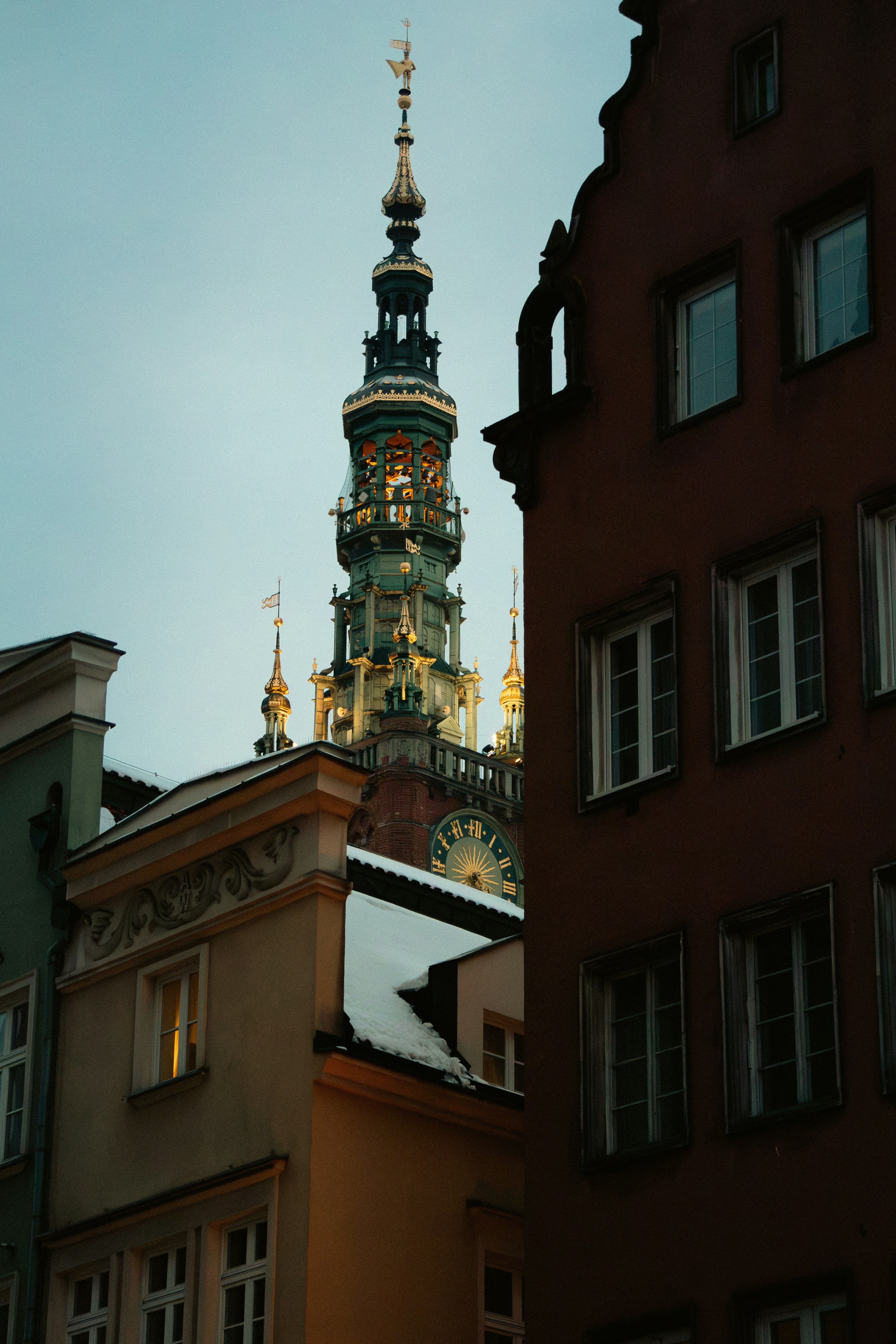 Towering Baroque Spire Rising Behind Narrow City Facades