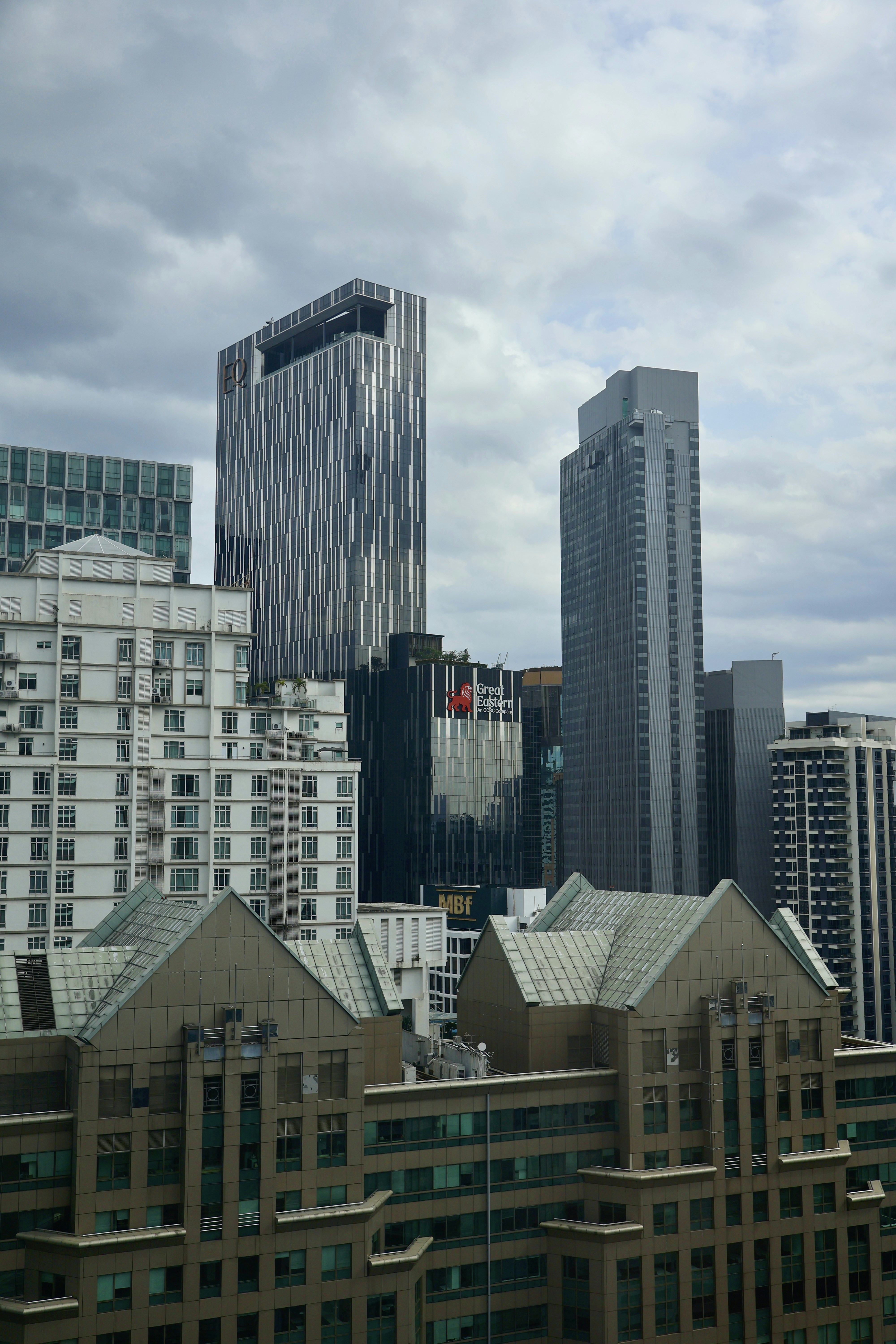 Skyline Stack: Tall, Glassy Towers Rise Above a Cropped Urban Canvas