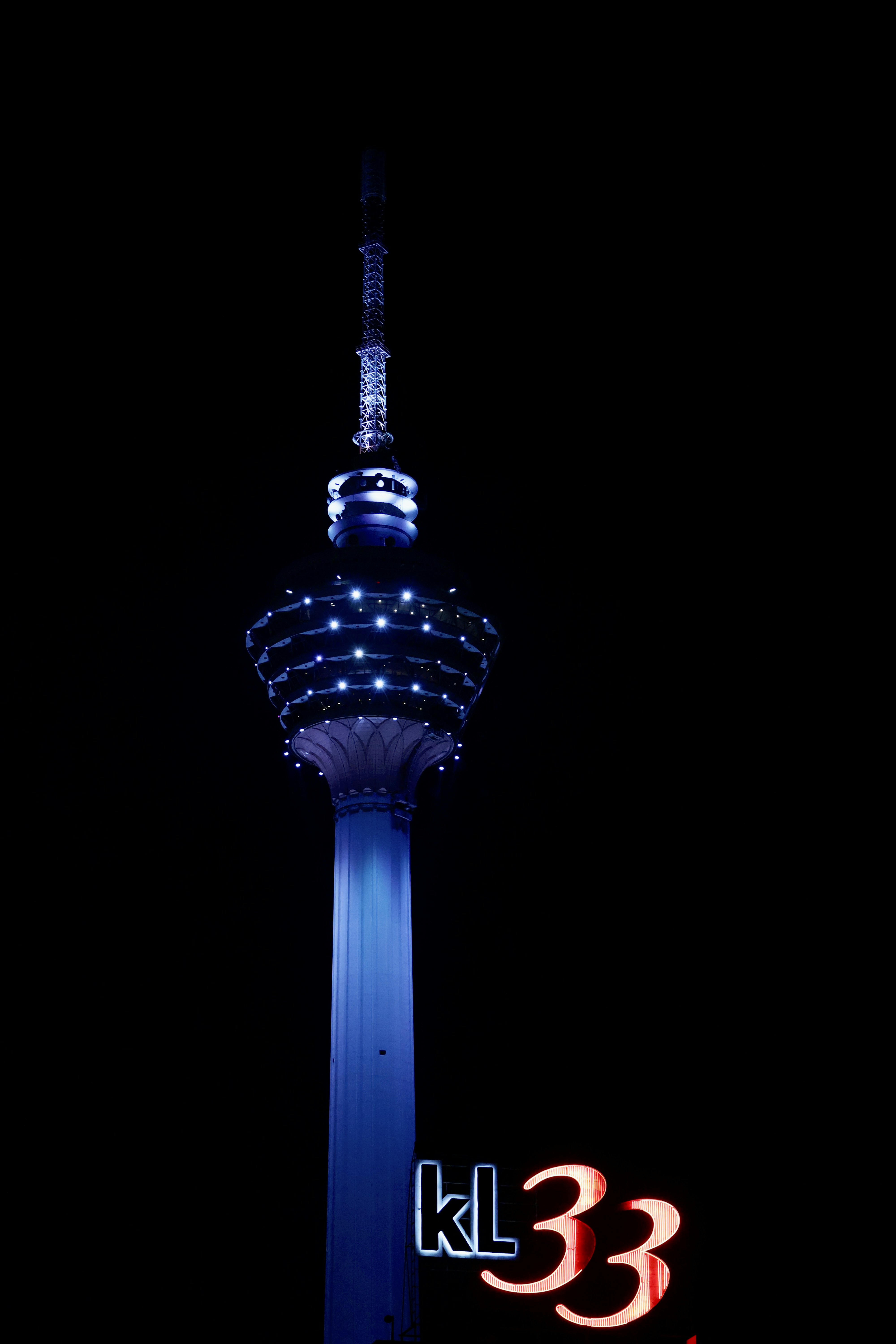 Midnight Beacon: KL Tower in Neon Blue