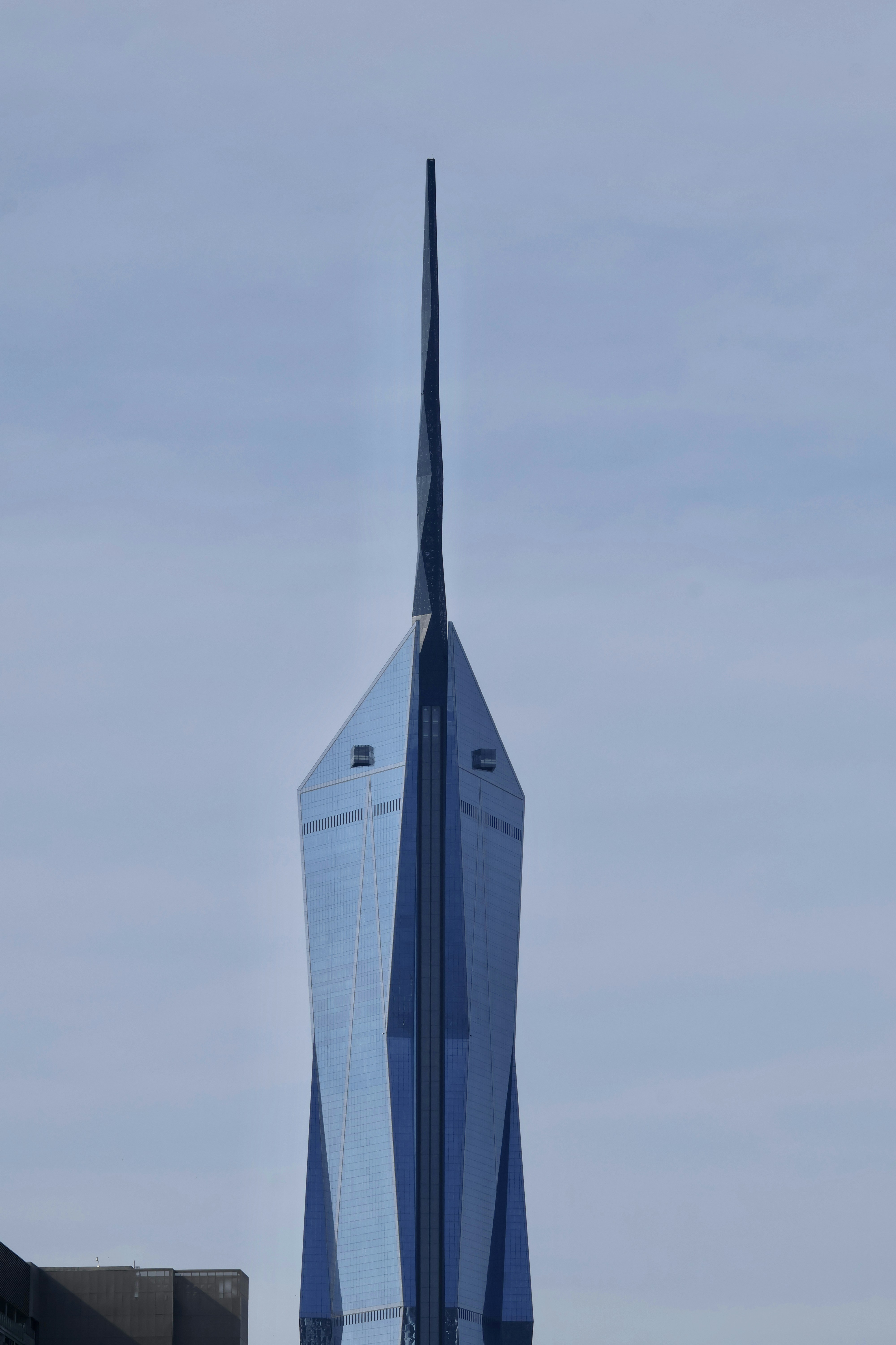 The Spire Piercing the Sky: A Prism of Glass